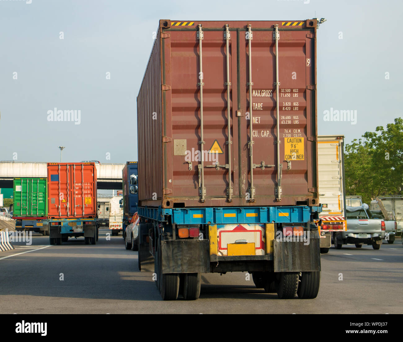Container transport by truck on the highway. Trucks transporting color ...