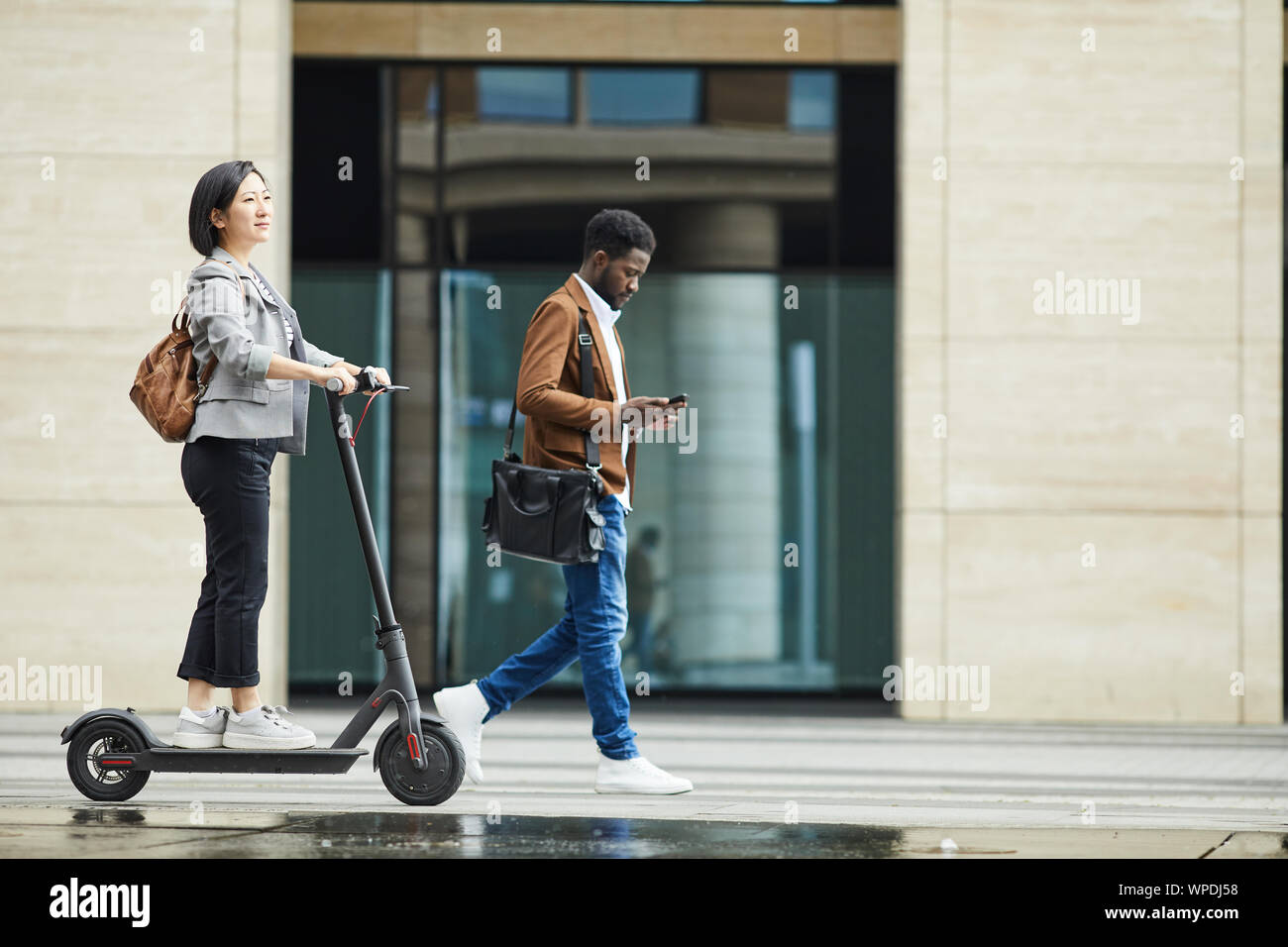 Two men on scooter hi-res stock photography and images - Alamy