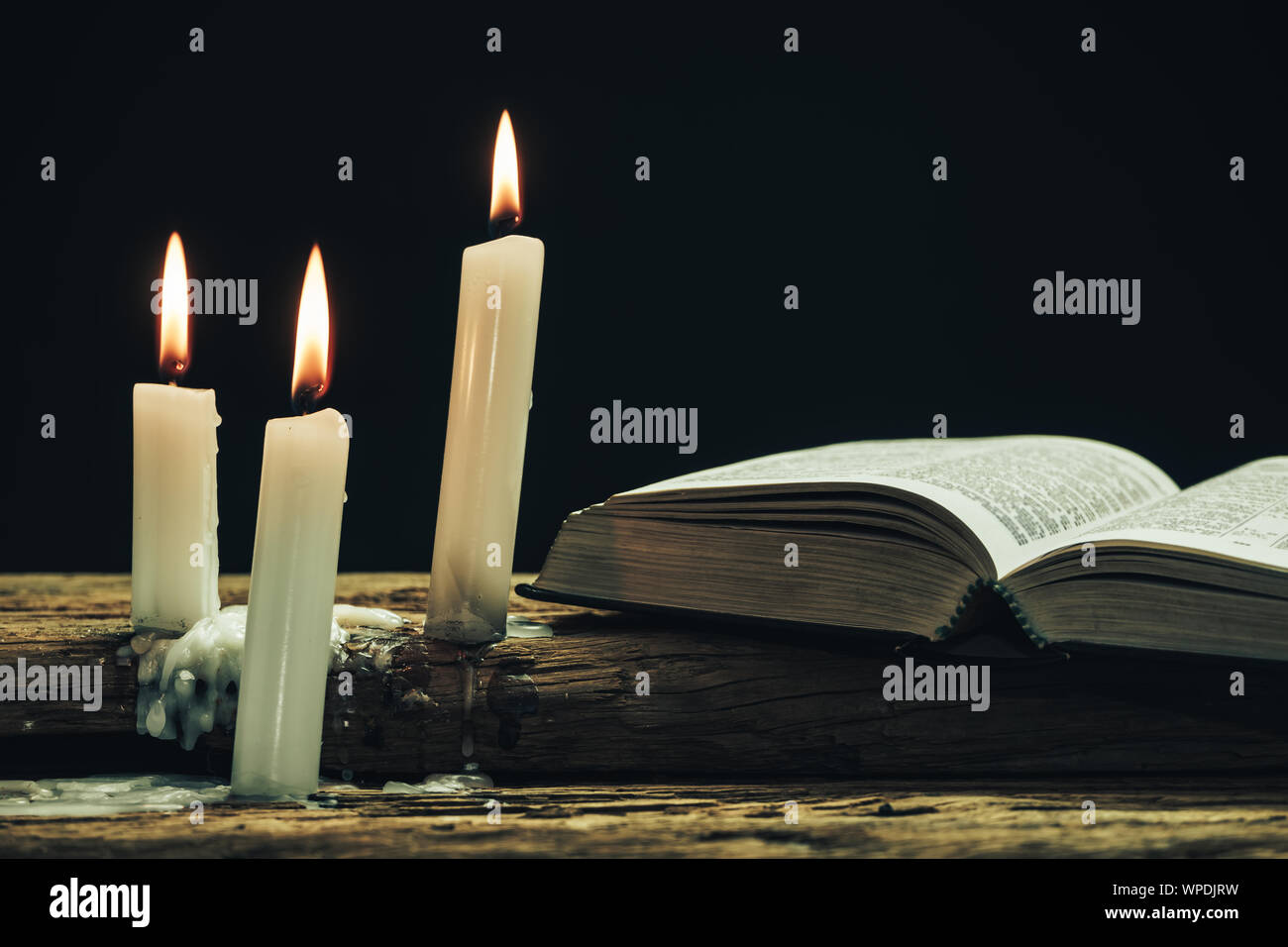 Open Bible Candles High Resolution Stock Photography and Images - Alamy