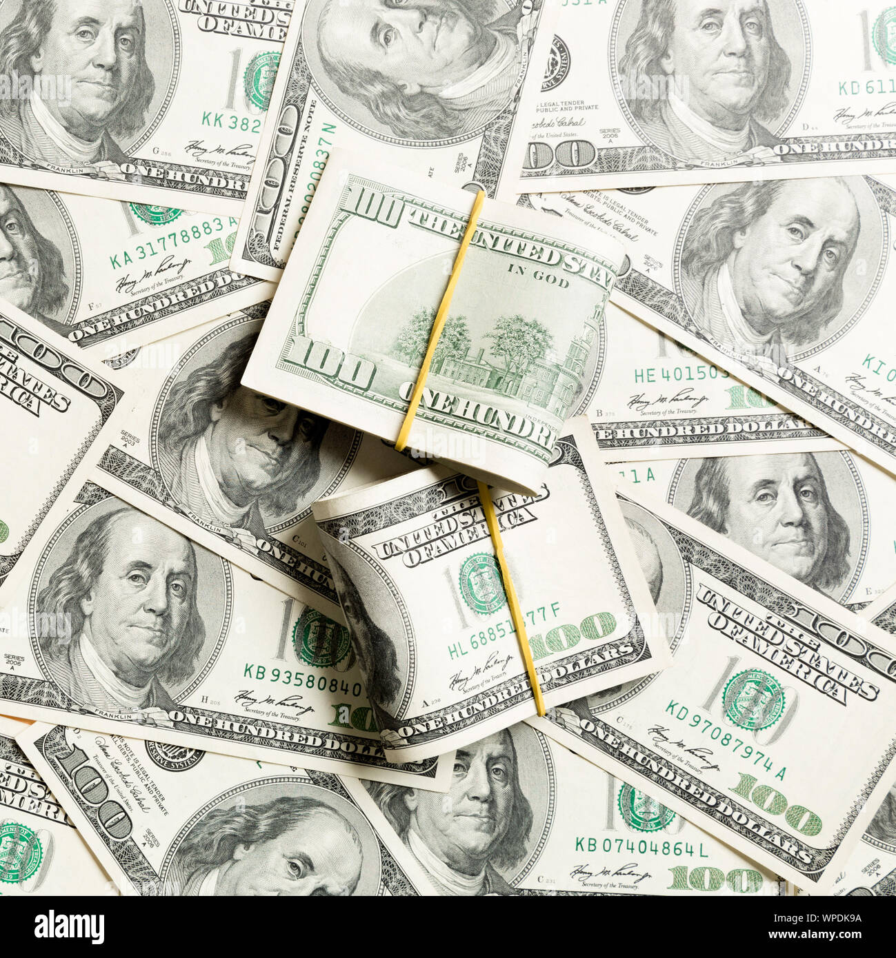 Stacks of one hundred dollars banknotes close-up on dollar background ...