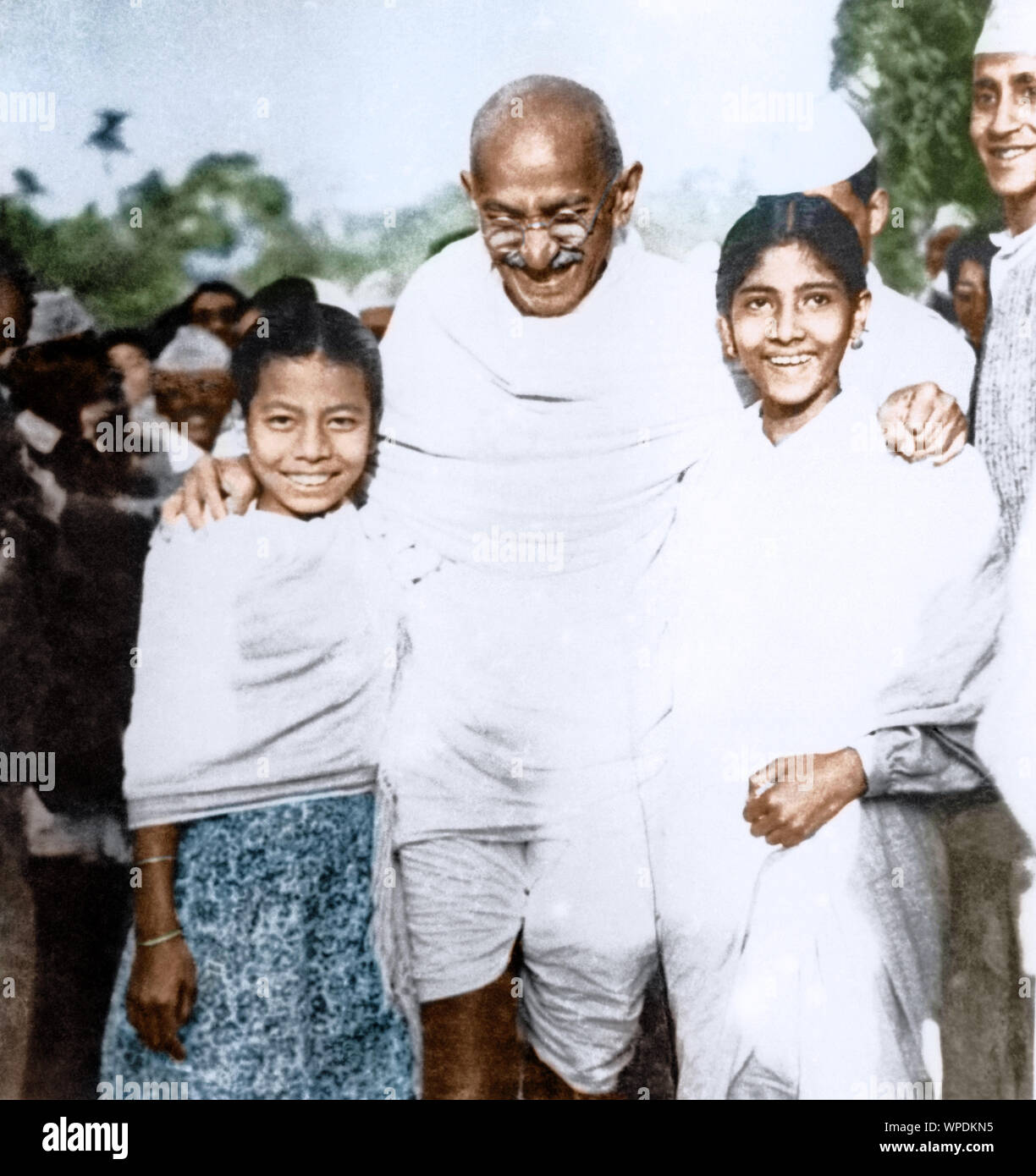 Mahatma Gandhi laughing with two girls supporting, India, Asia, 1945 ...