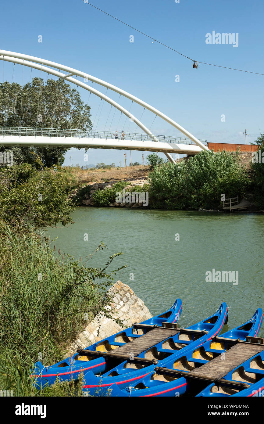 Canoes anchored at harbour in the green Ombrone river, idea for a ...
