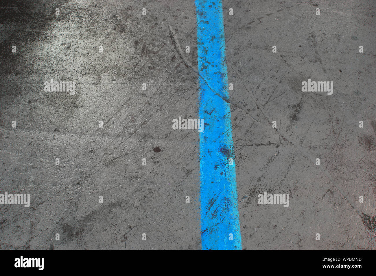 Blue Line on scratched cement floor Stock Photo - Alamy