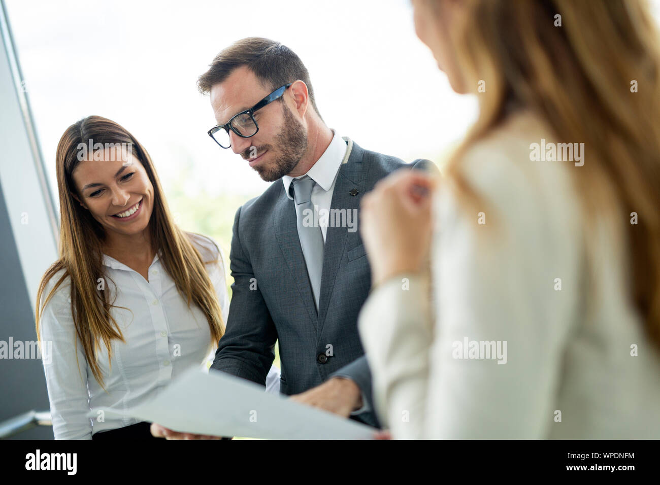 Group of coworkers working together on business project in modern ...