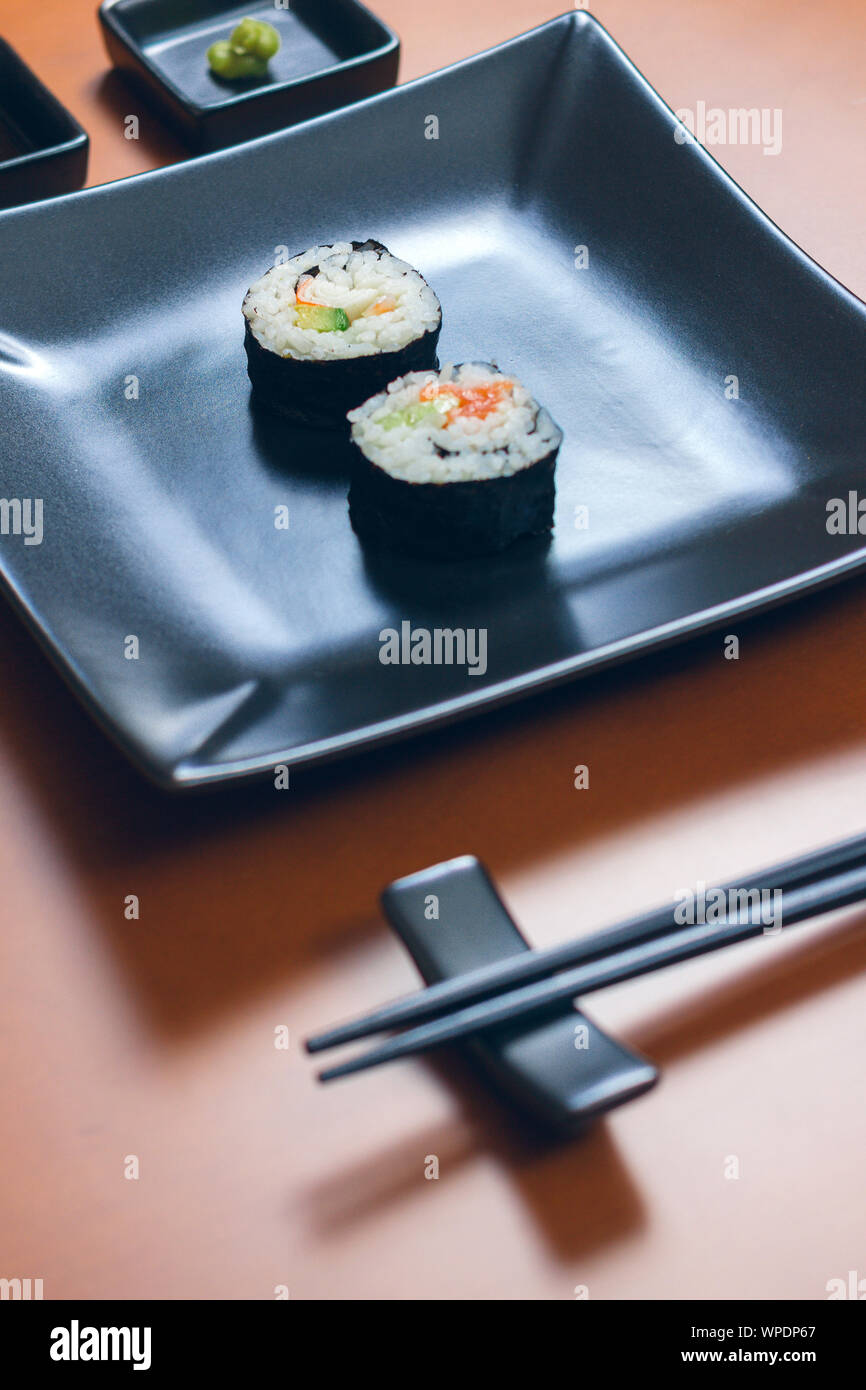 Sushi rolls chopsticks wood hi-res stock photography and images - Alamy