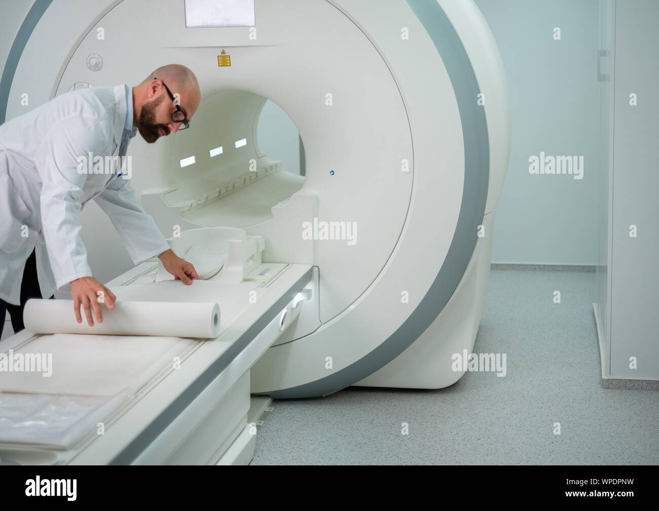 Doctor preparing MRI scanner in a hospital Stock Photo - Alamy