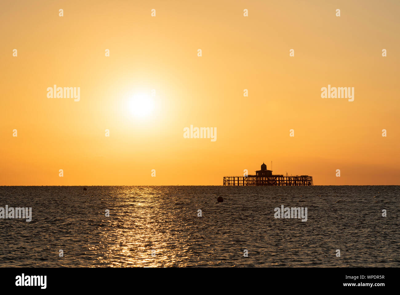 Sunset at the isolated pier head off the Kent coast at Herne Bay Stock ...