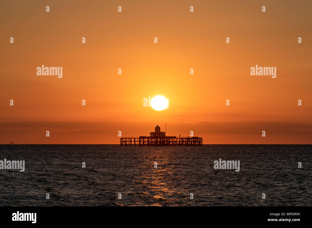 Sunset at the isolated pier head off the Kent coast at Herne Bay Stock ...