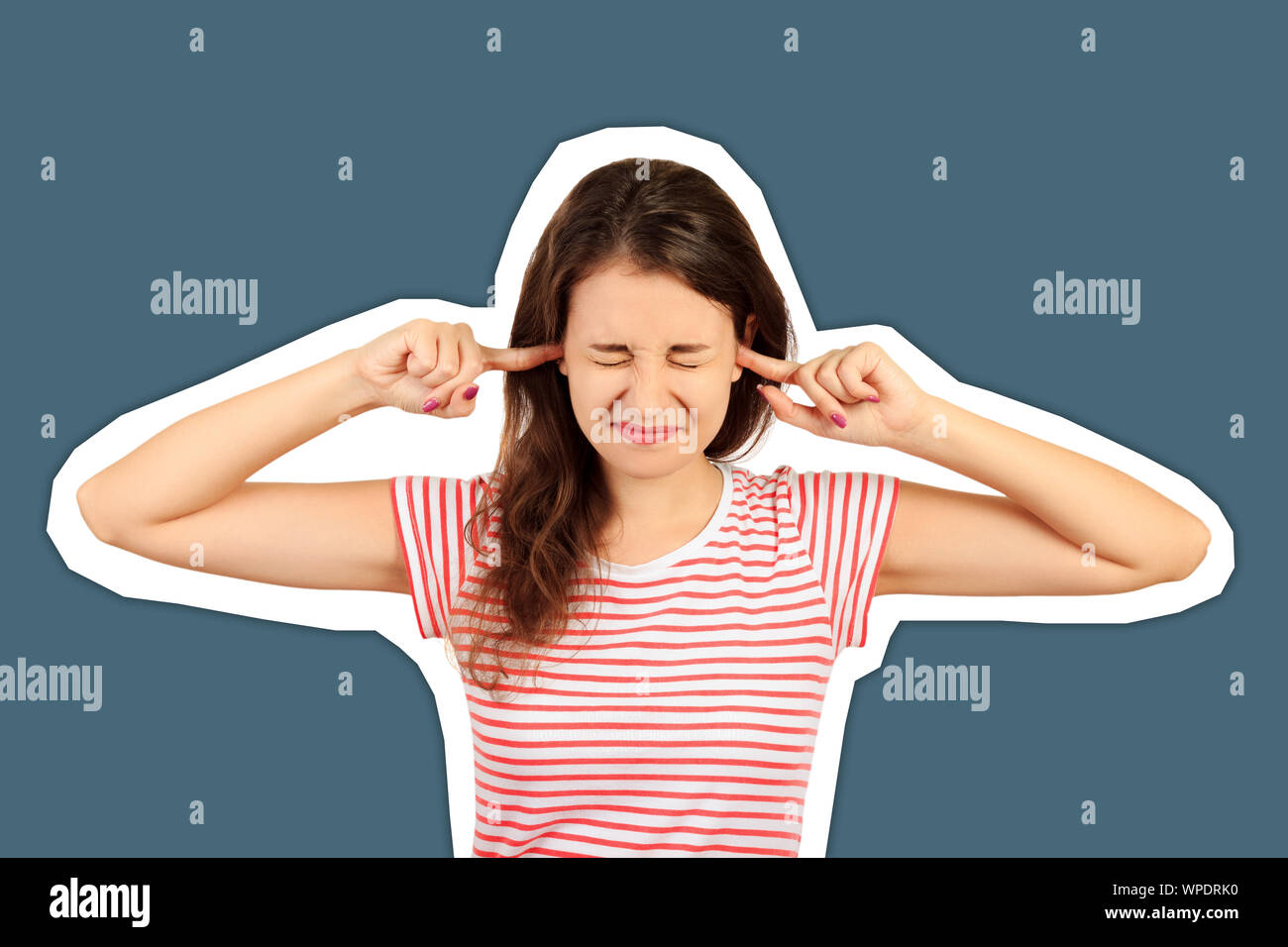 Portrait of angry stressed out young woman plugging ears with fingers ...
