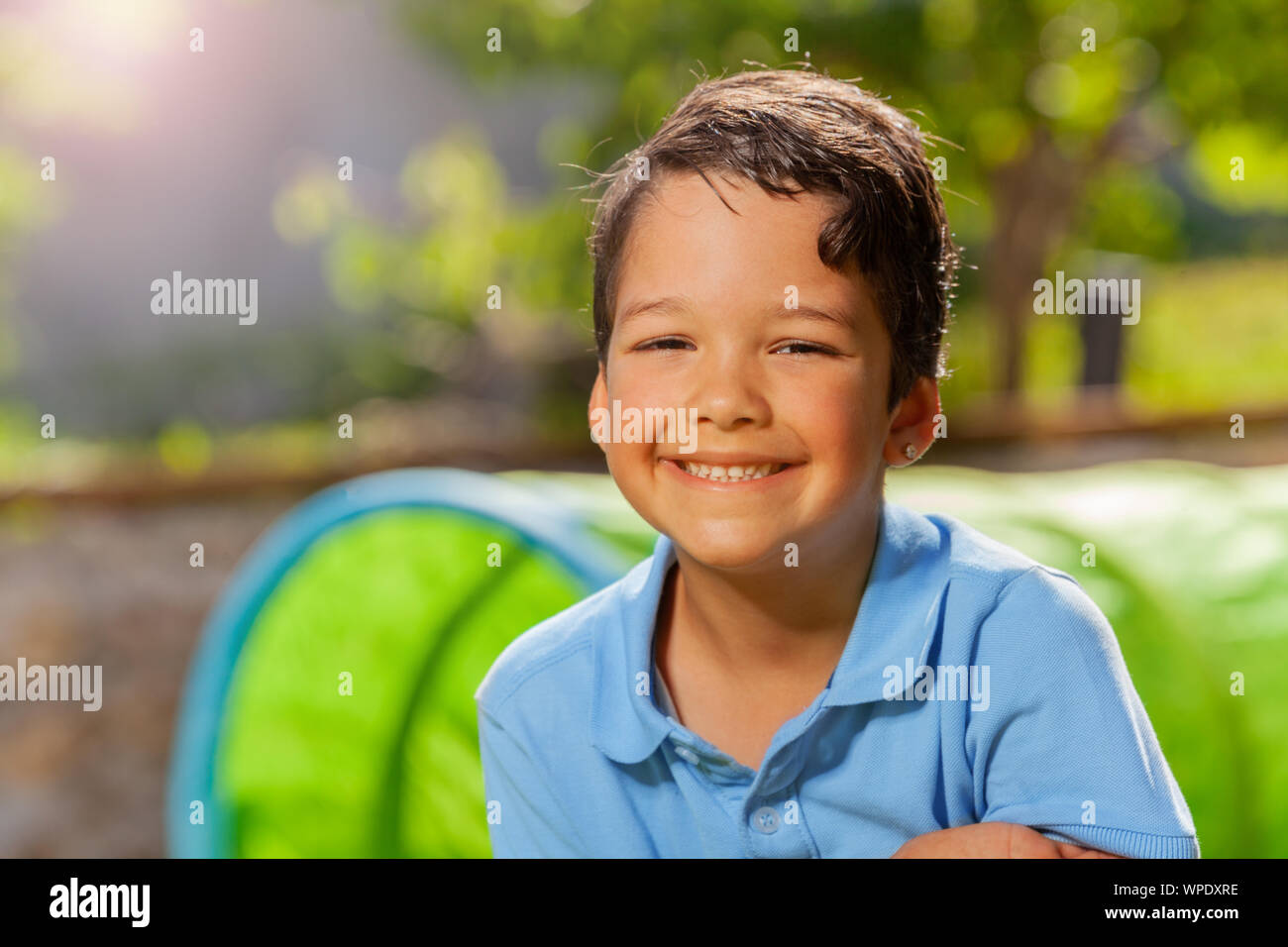 Summer day close portrait of a smiling cute boy Stock Photo - Alamy