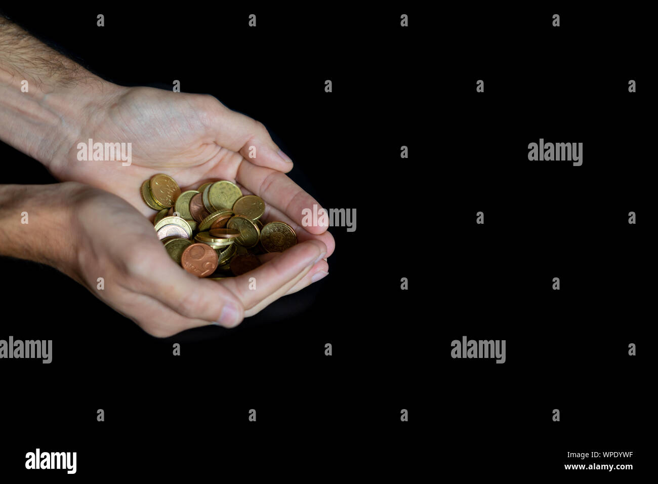 Man hands holding coins hi-res stock photography and images - Alamy