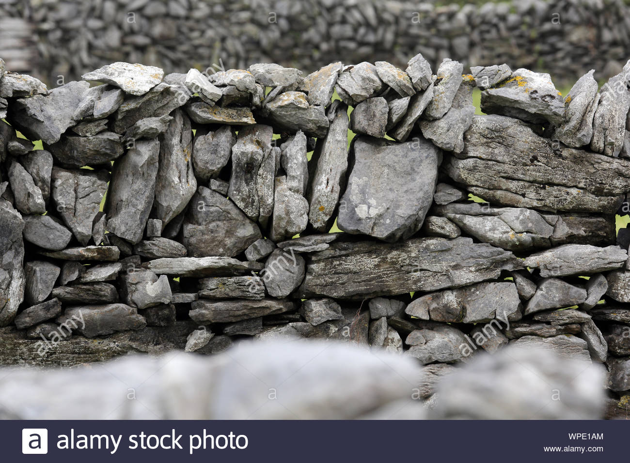 A beautiful grey stone wall on the island of Inisheer, one of the Aran ...