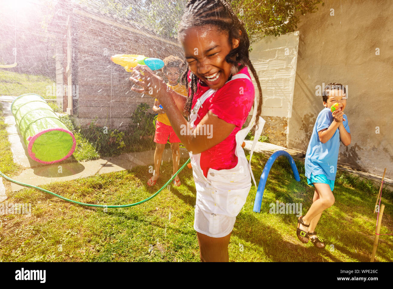 Water pistol fight hi-res stock photography and images - Alamy