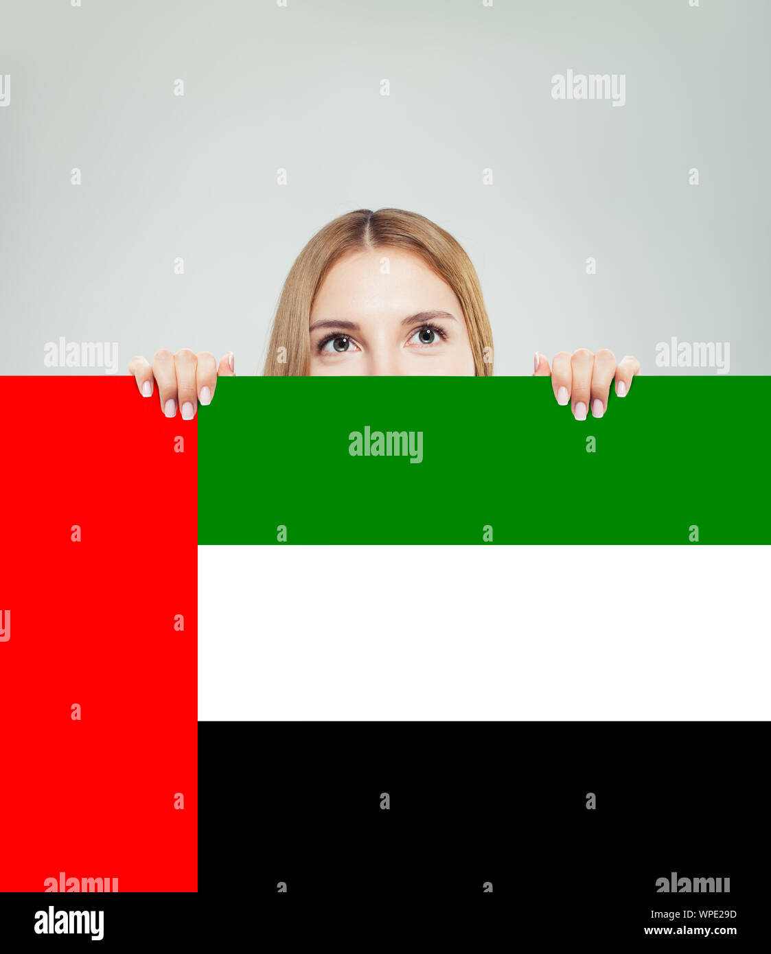Happy woman student with the UAE flag background. United Arab Emirates ...