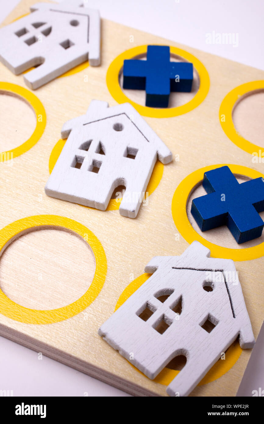 tic tac toe using house shape - real estate strategy Stock Photo - Alamy