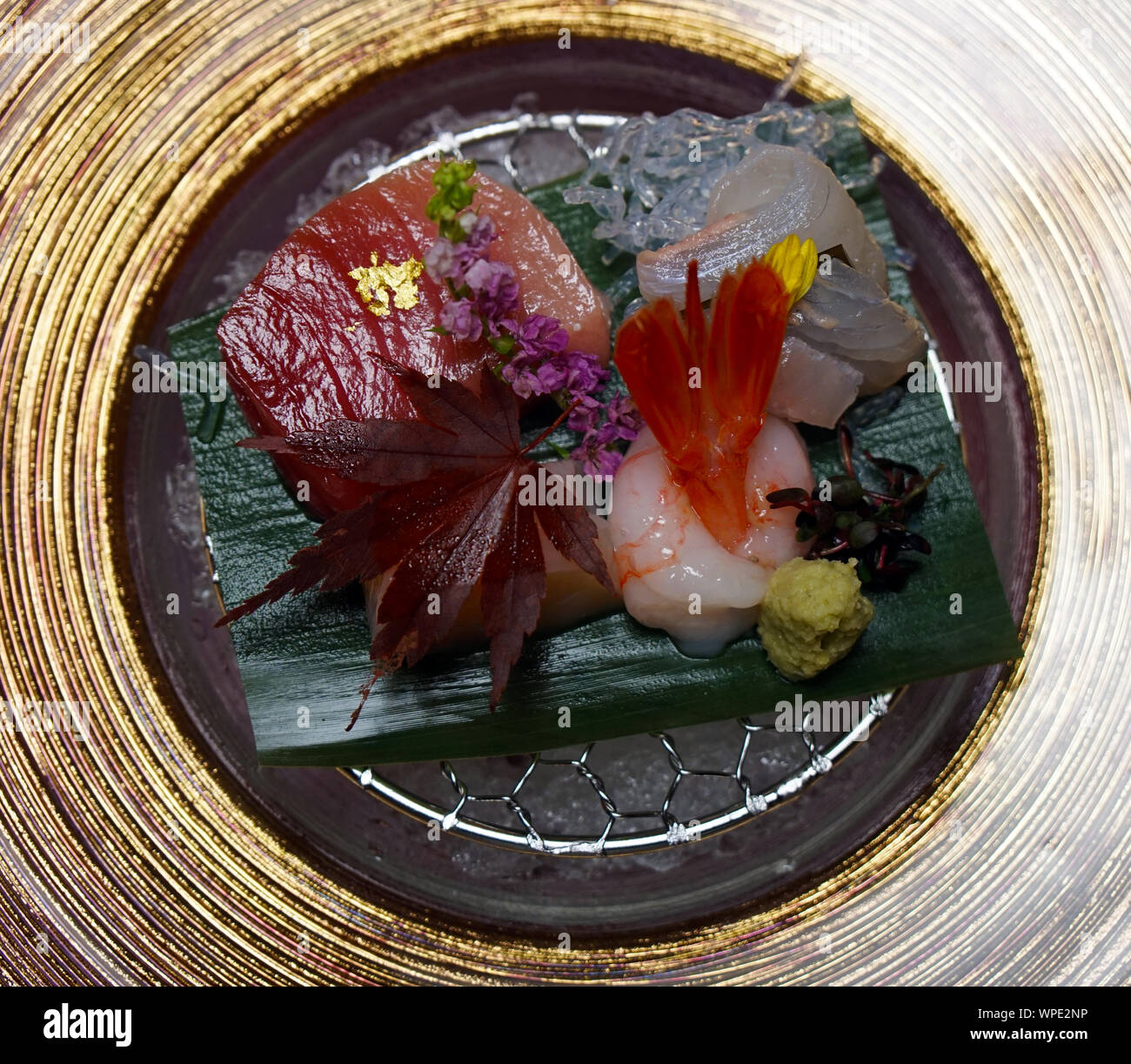 Sashimi on a golden plate, Japanese kaiseki traditional dinner ...