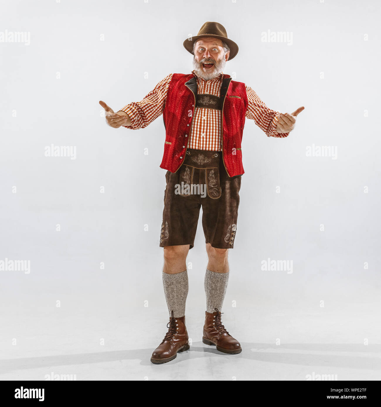 Portrait of Oktoberfest senior man in hat, wearing the traditional ...
