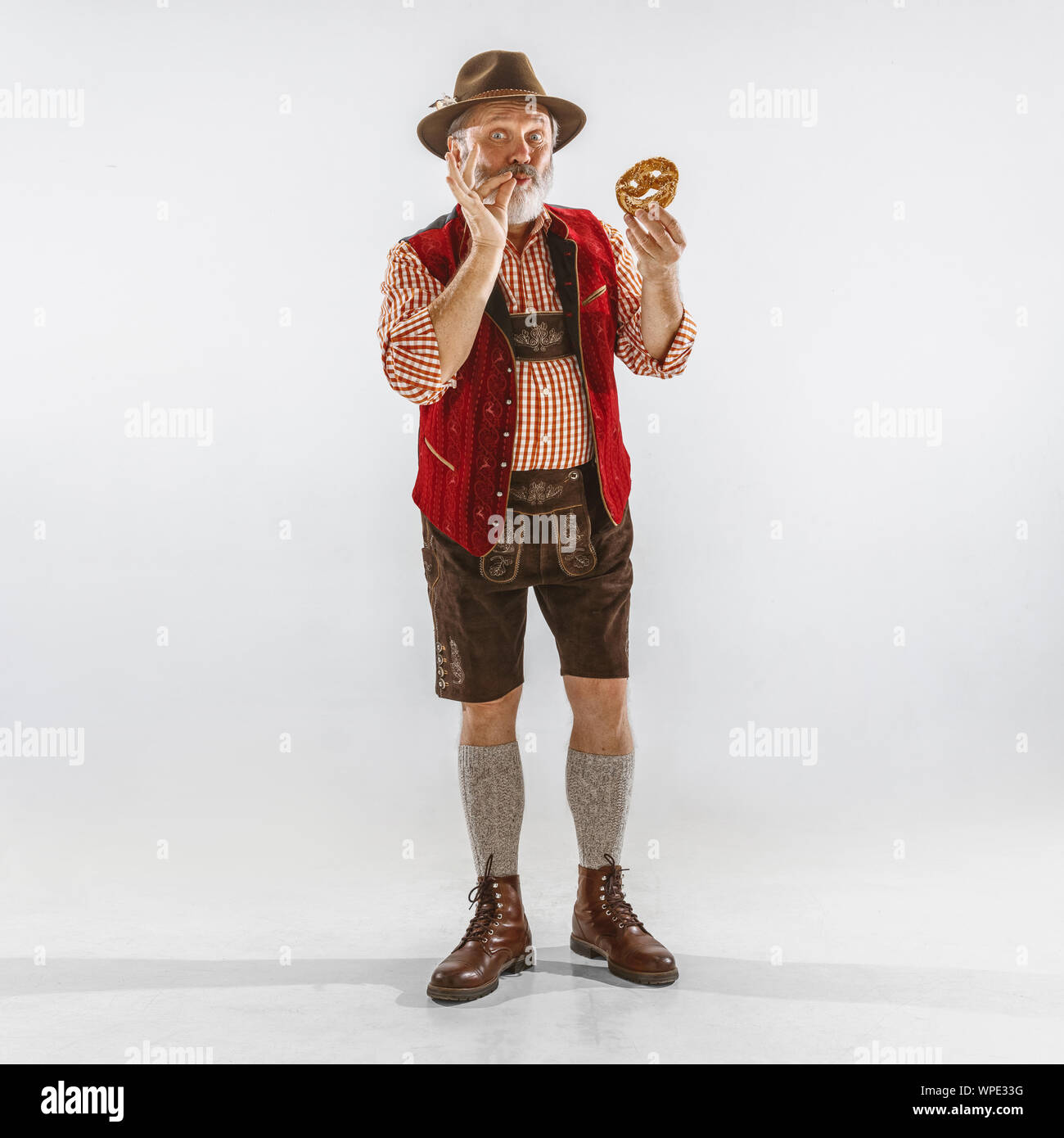 Portrait of Oktoberfest senior man in hat, wearing the traditional ...