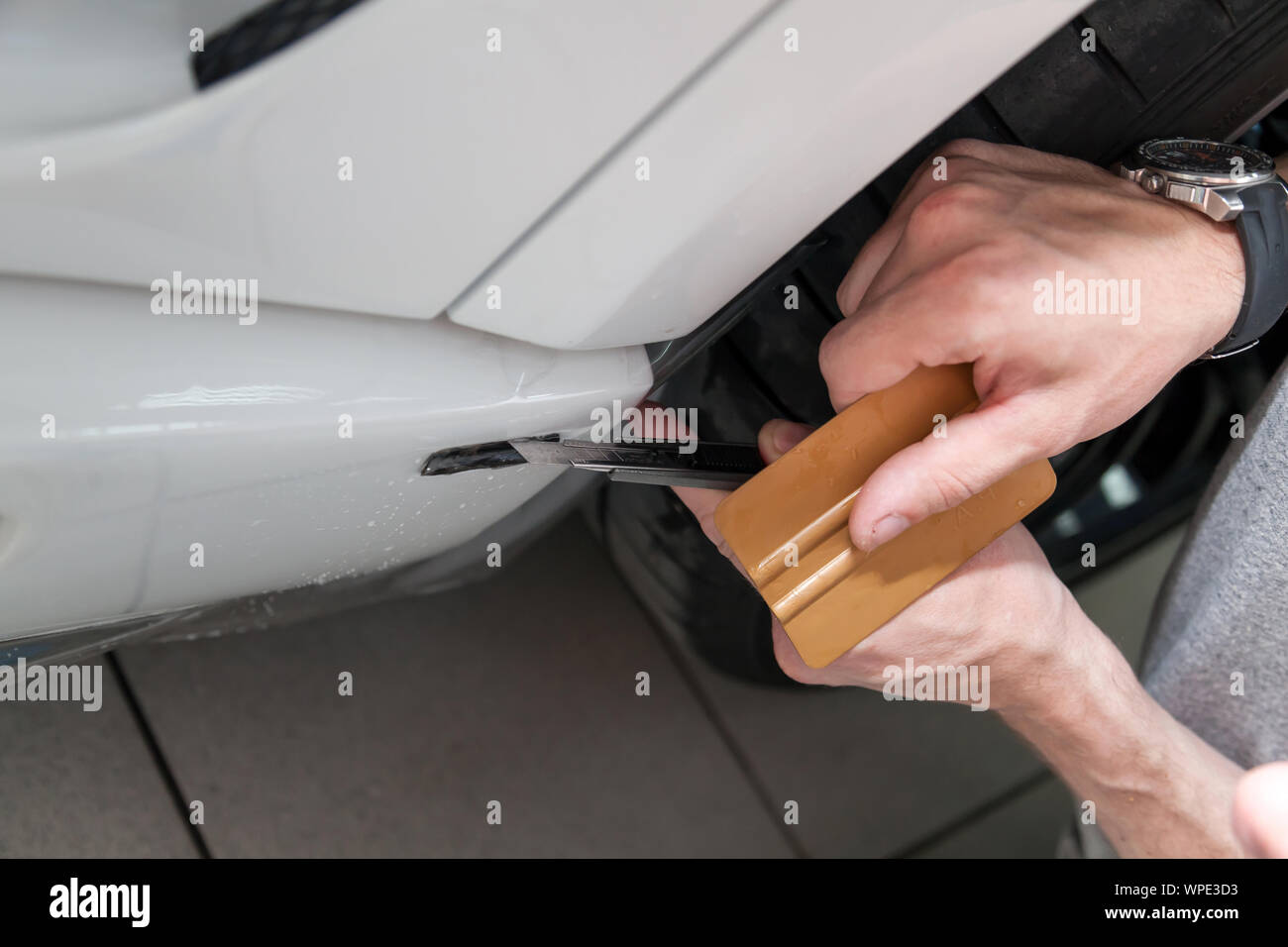 Retrofitting the car with a solid transparent protective film, the ...