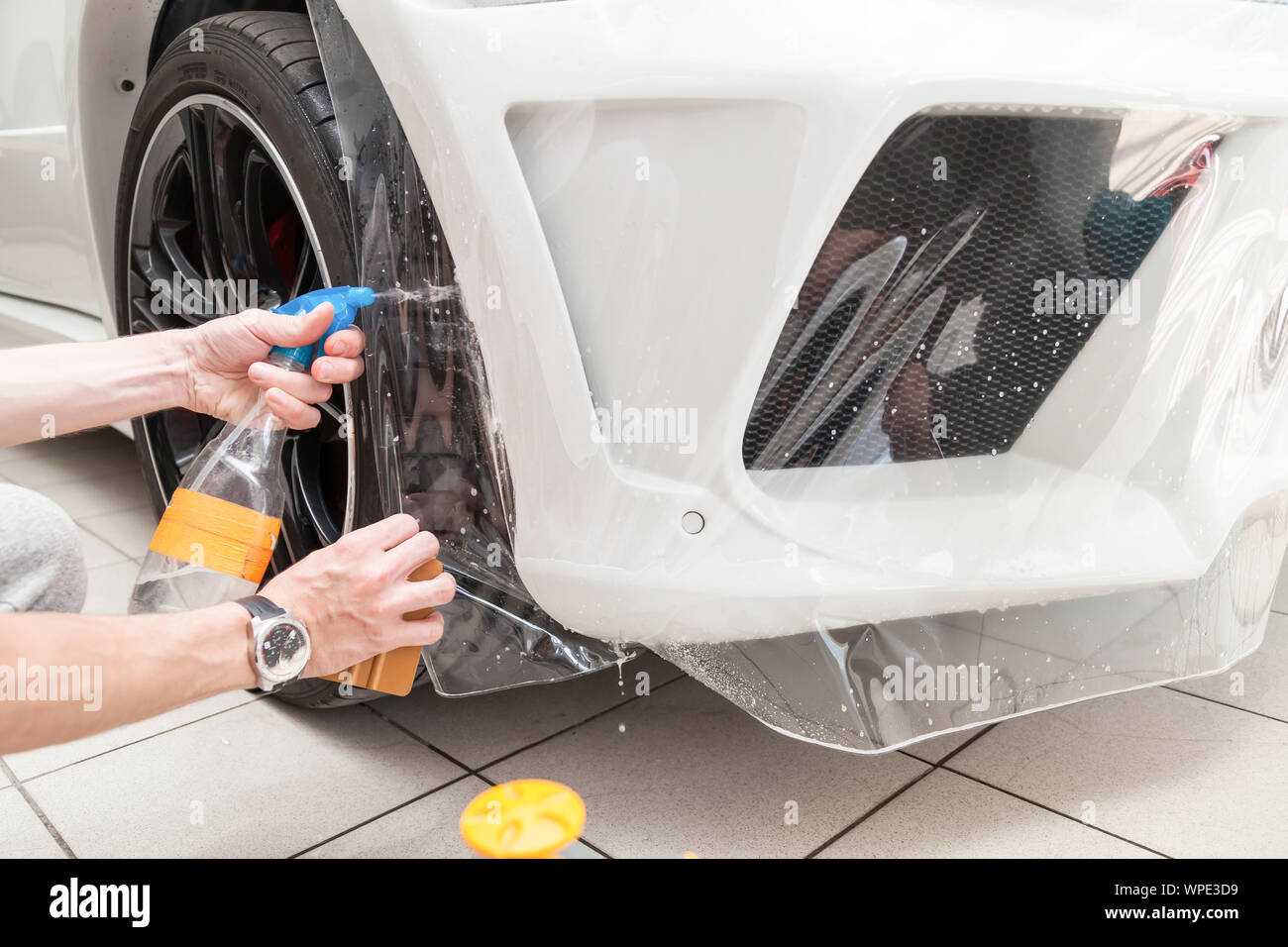 Retrofitting the car with a solid transparent protective film, the ...