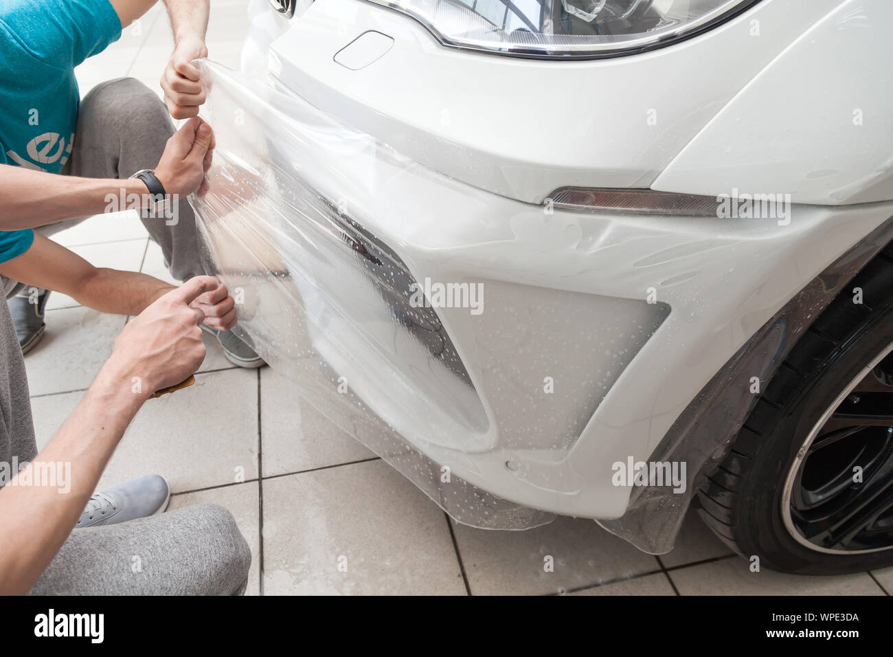 Retrofitting the car with a solid transparent protective film, the ...
