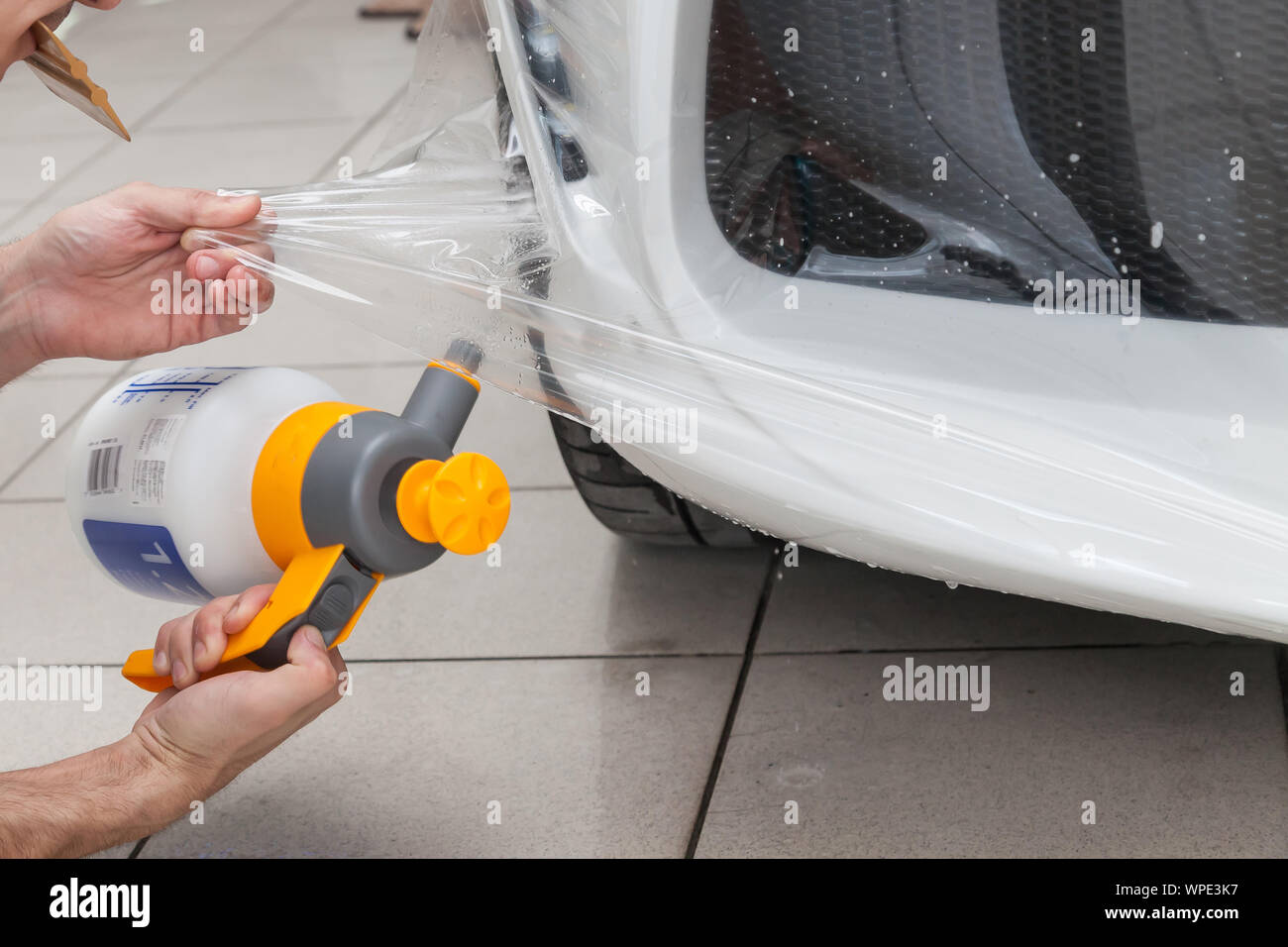 Retrofitting the car with a solid transparent protective film, the ...