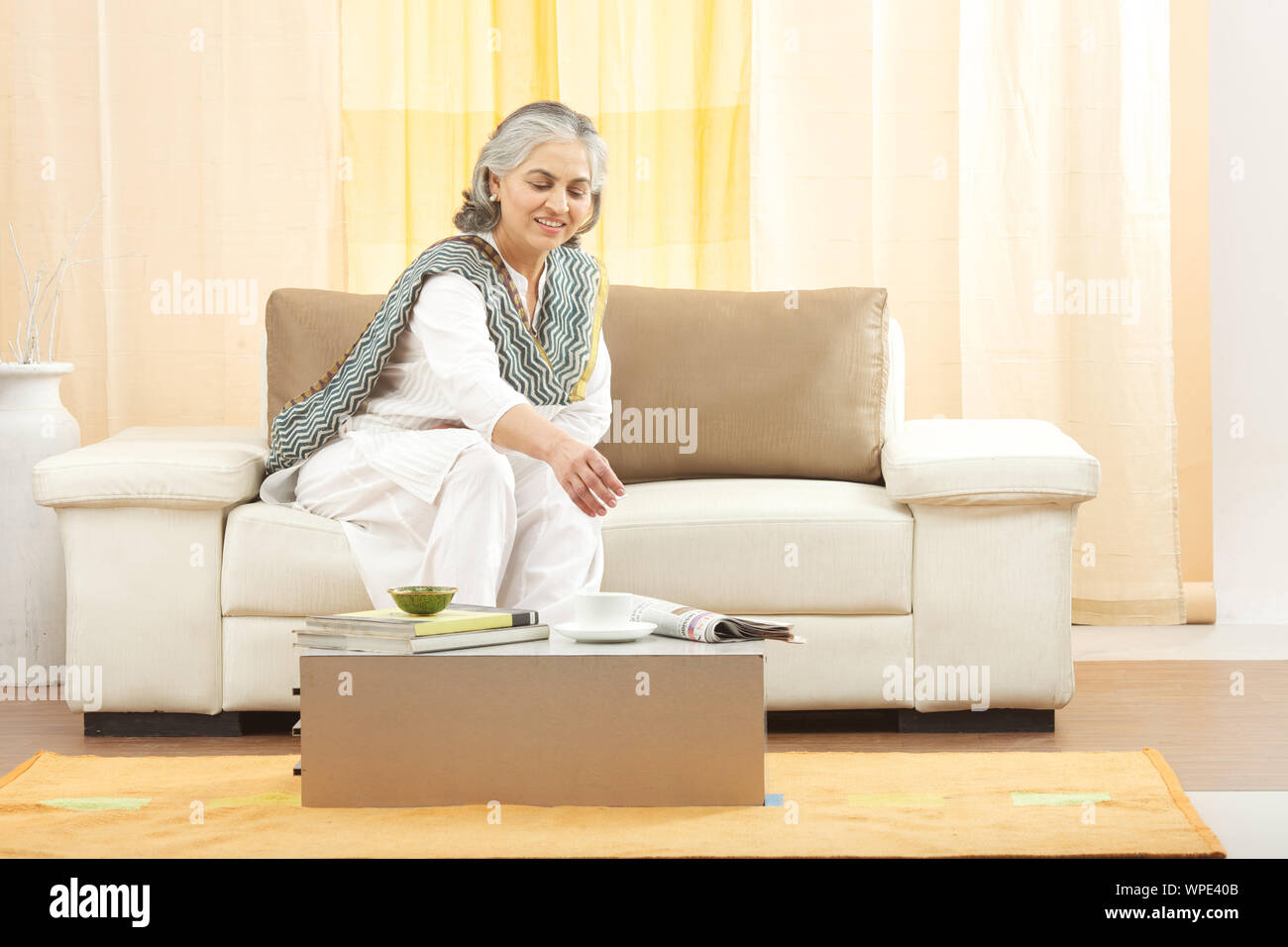 Picking up newspaper hi-res stock photography and images - Alamy