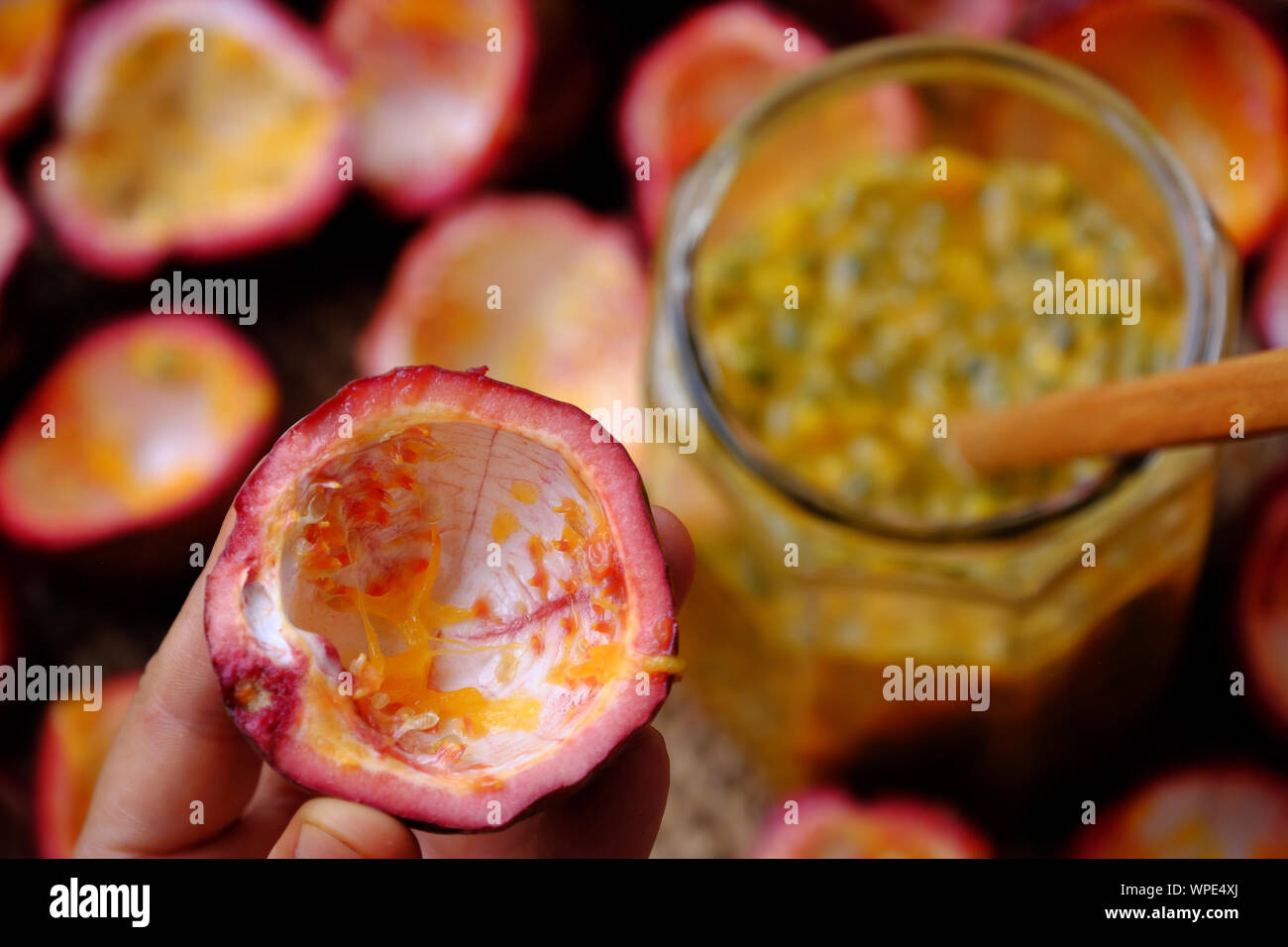 Close up passion fruit hard rind after take soft pulp and seeds inside ...
