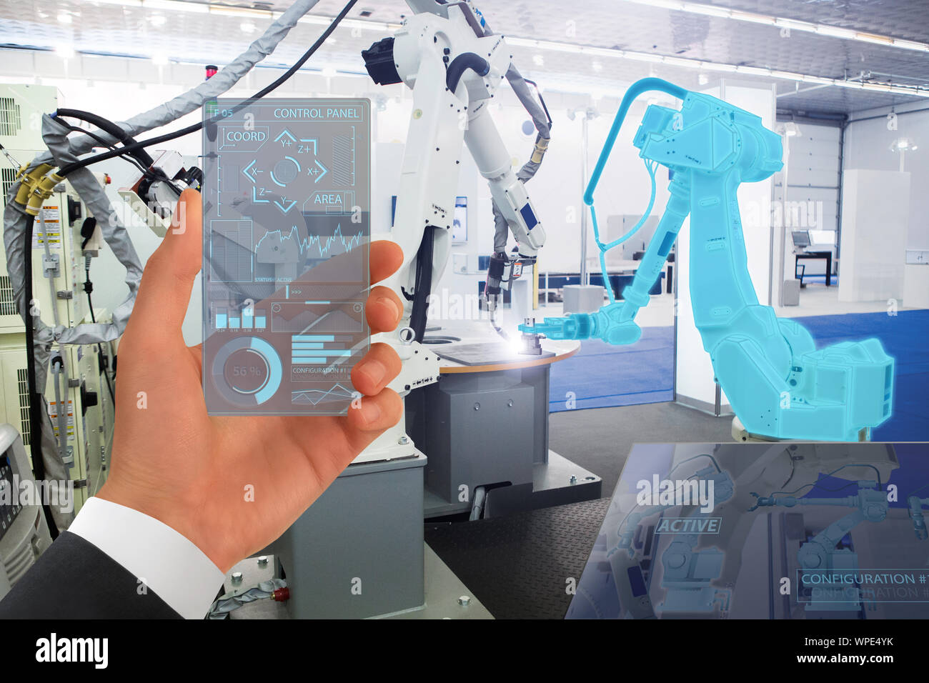 Engineer uses a futuristic transparent smartphone to control robotic ...