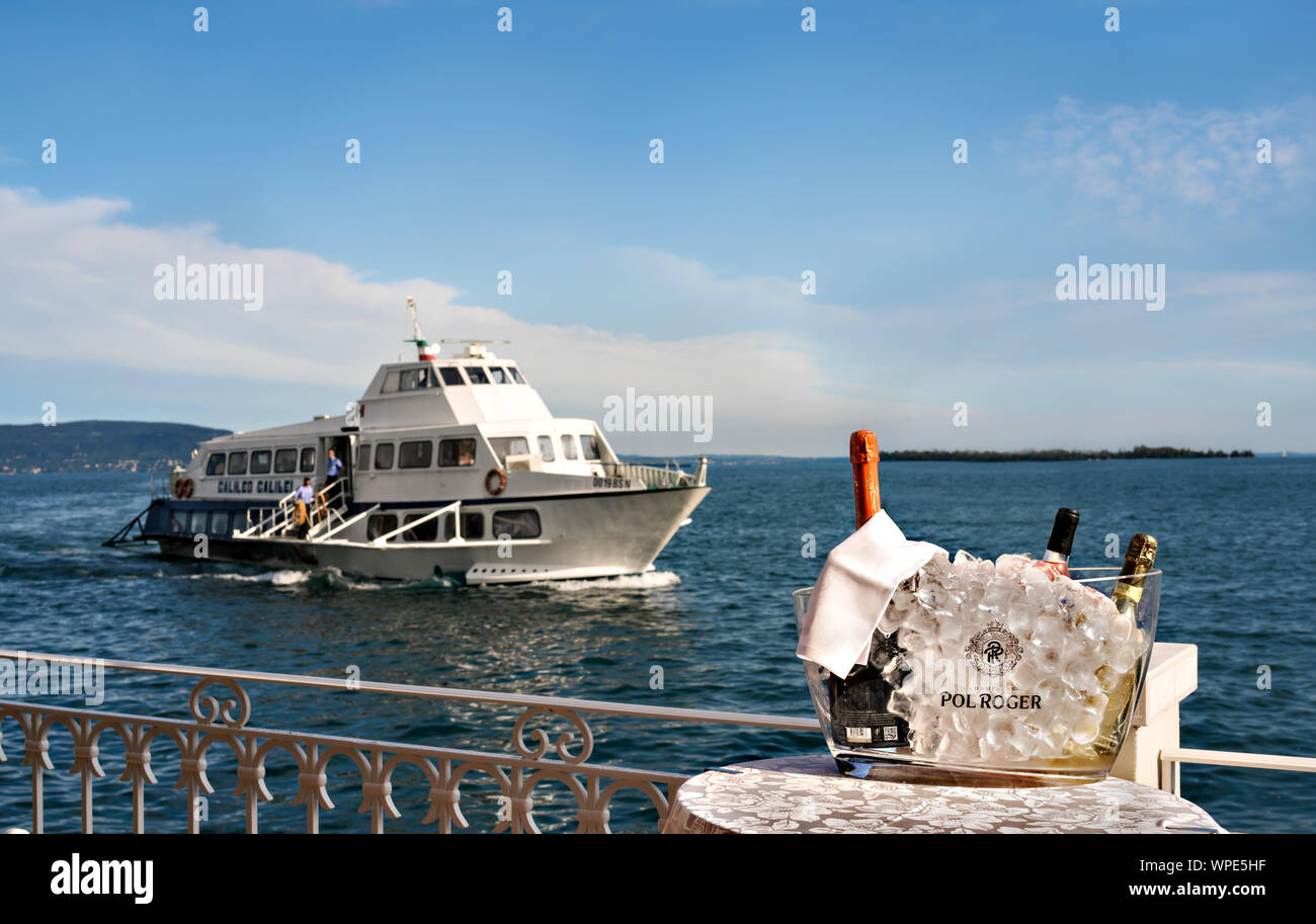 Fast ferry arriving at terminal in Lake Garda with champagne on ice in ...