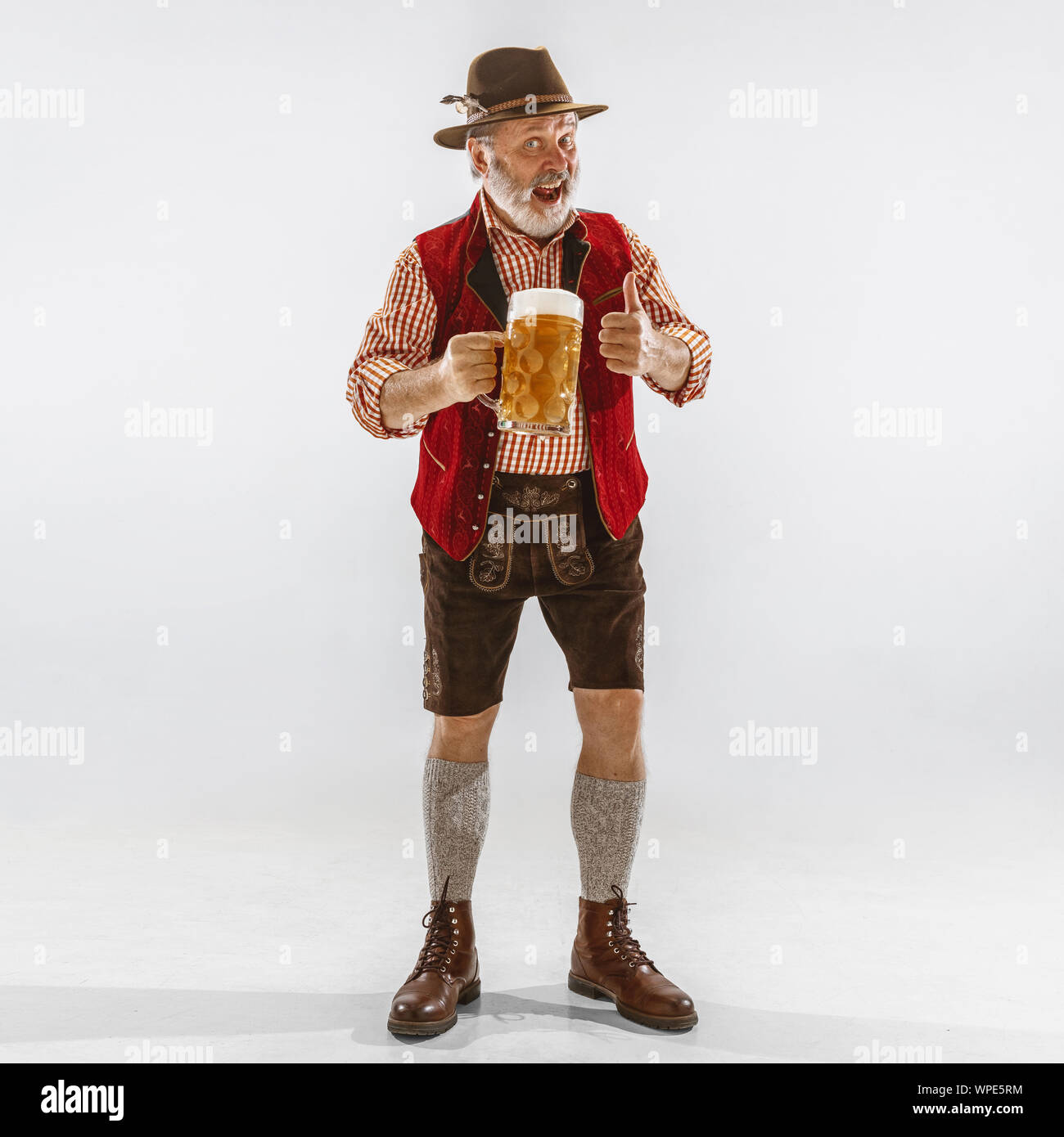 Portrait of Oktoberfest senior man in hat, wearing the traditional ...