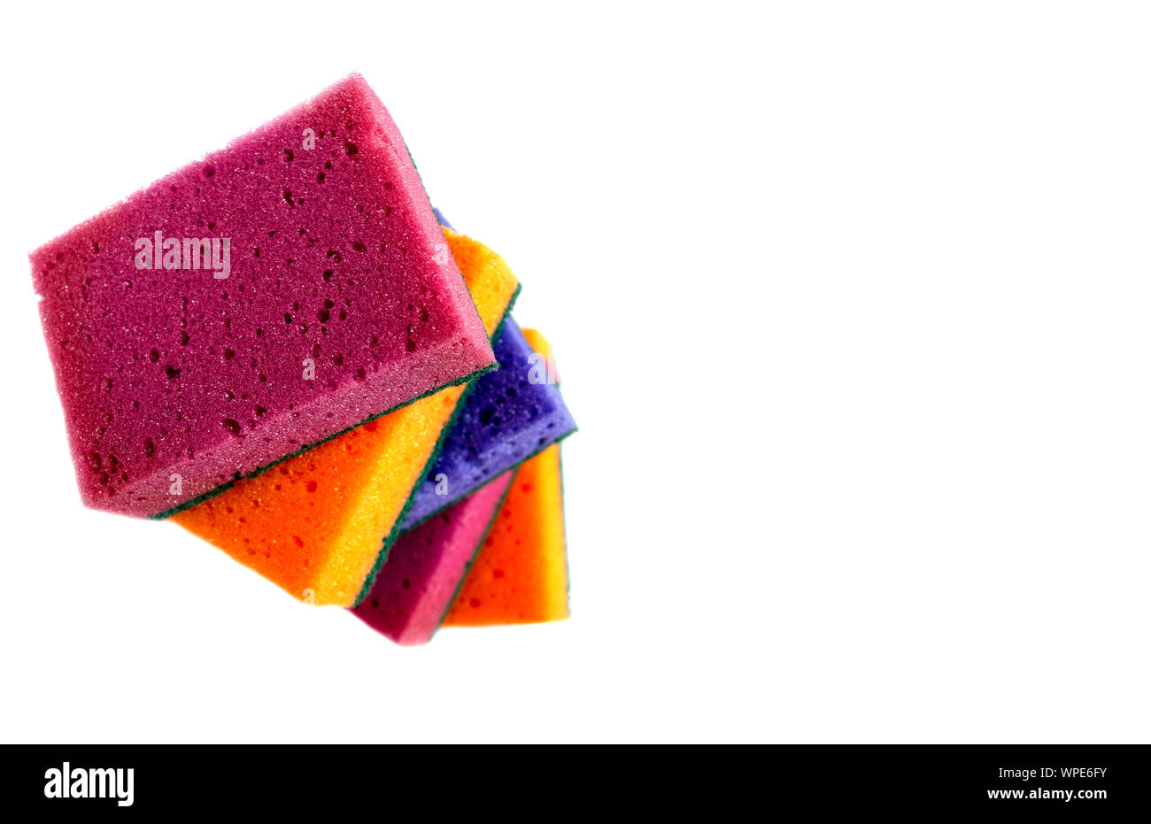 Multi-colored cleaning sponges for washing dishes on a white background ...
