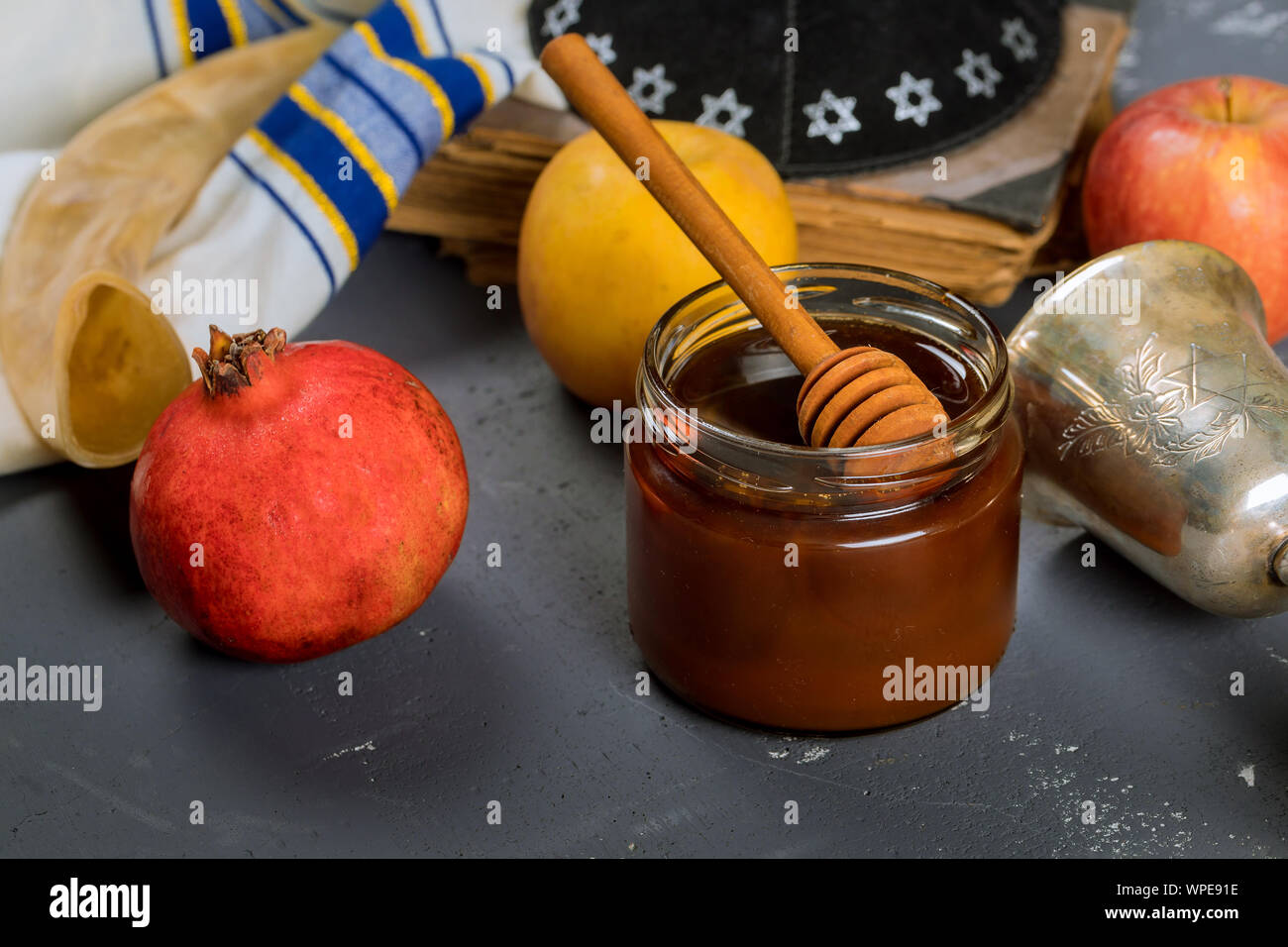 Honey on the pomegranate and apples. Jewishs new year Rosh Ha Shana ...