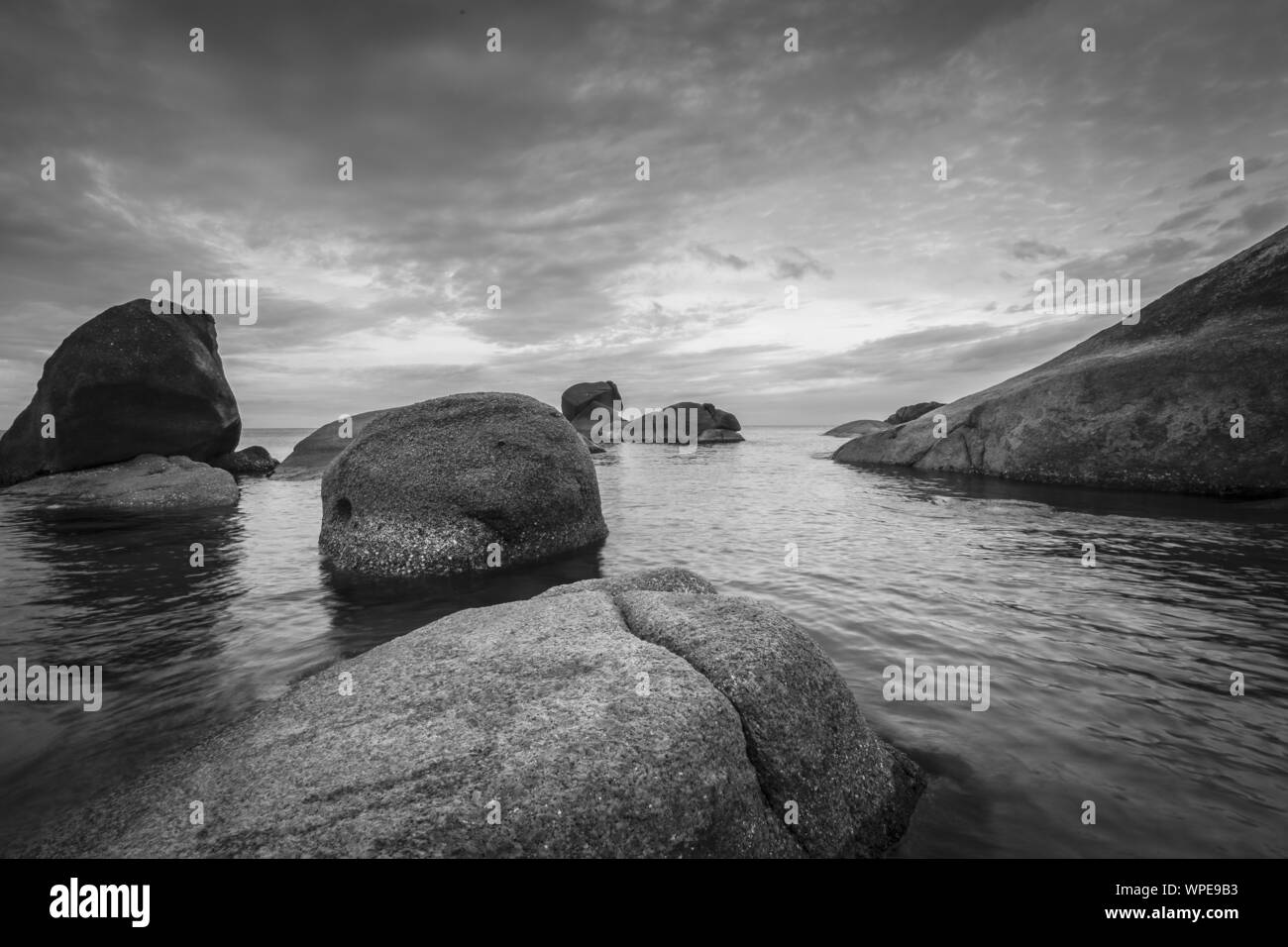 Rocks in ocean Stock Photo - Alamy