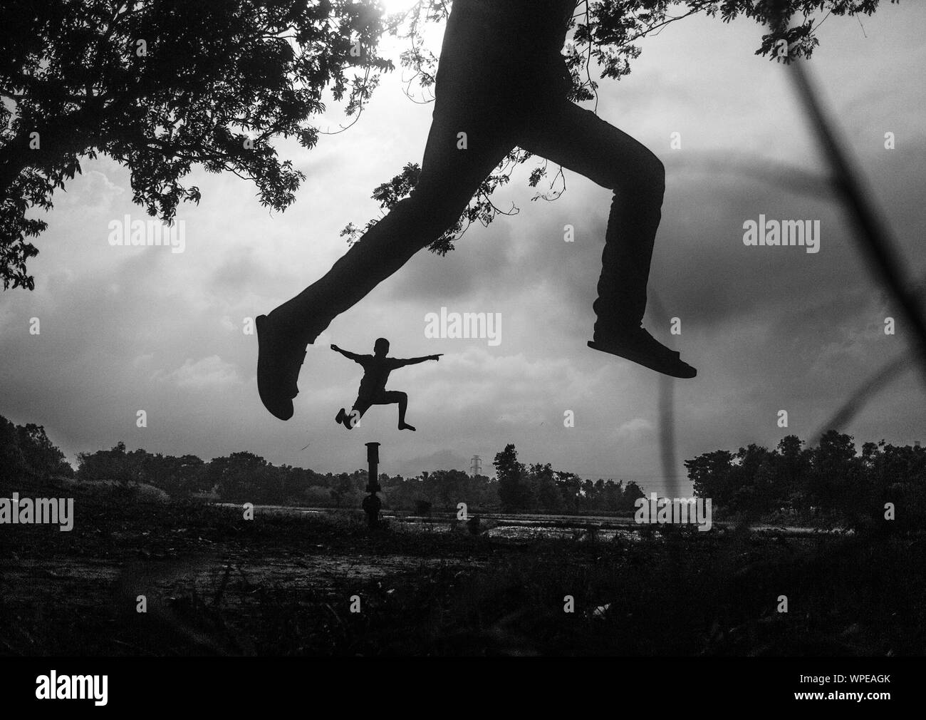 Boys jumping into hi-res stock photography and images - Alamy