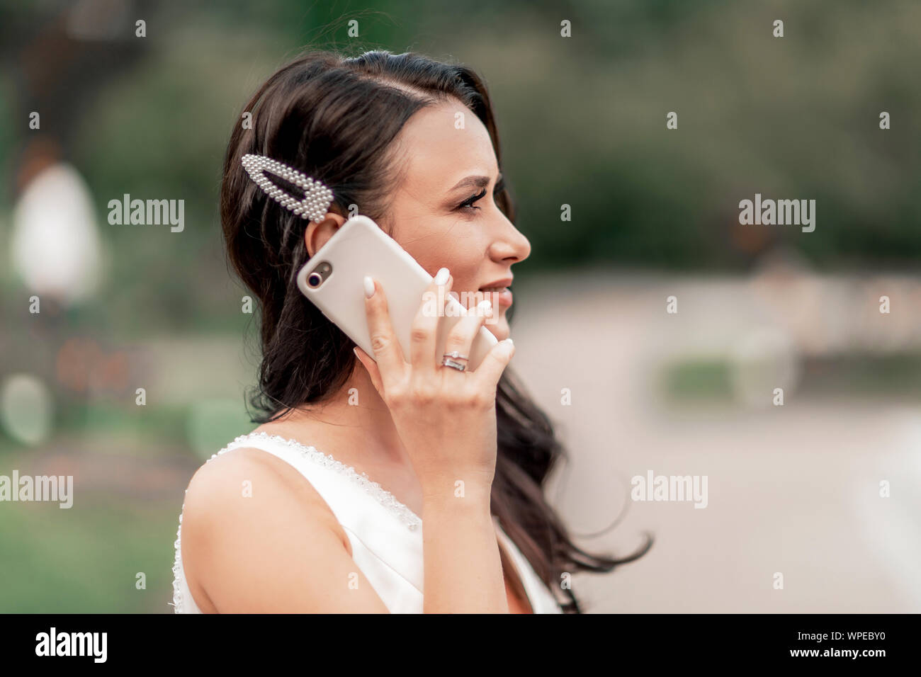 close up. bride talking on her smartphone Stock Photo - Alamy