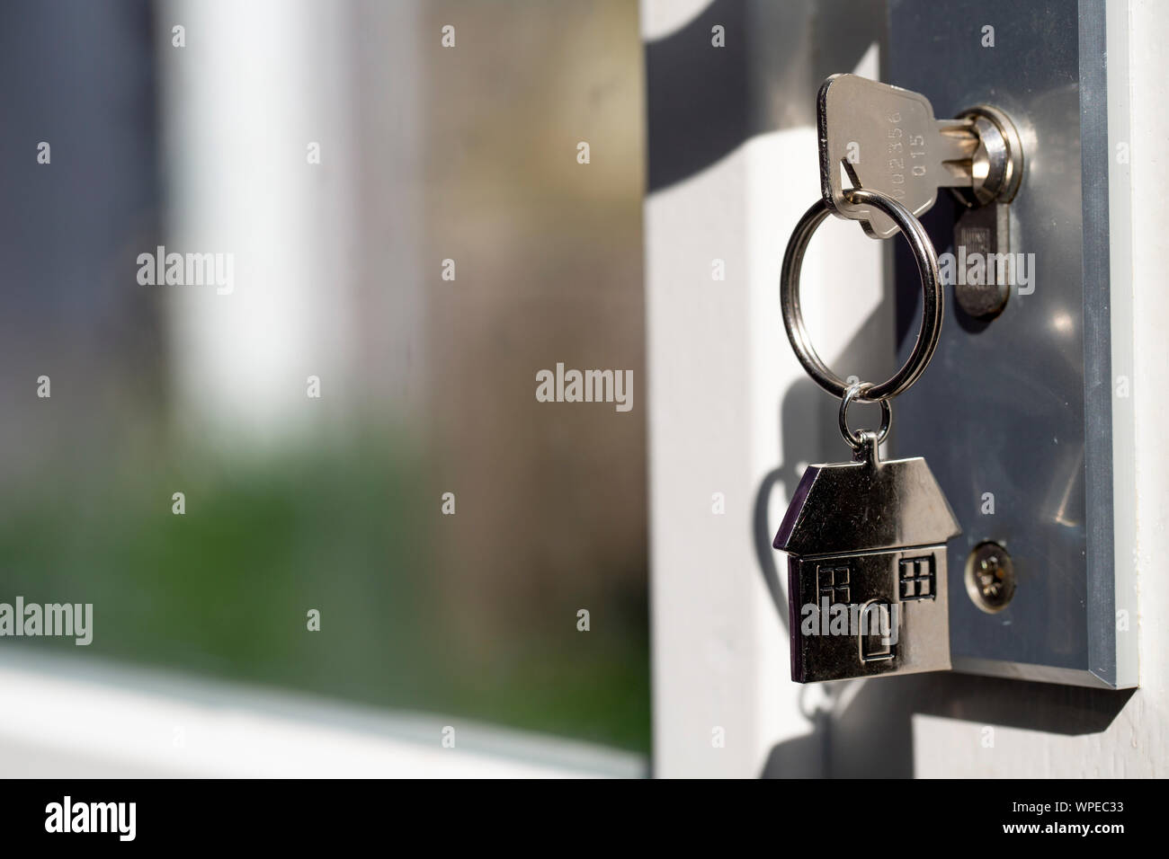 Key in lock new home Stock Photo - Alamy