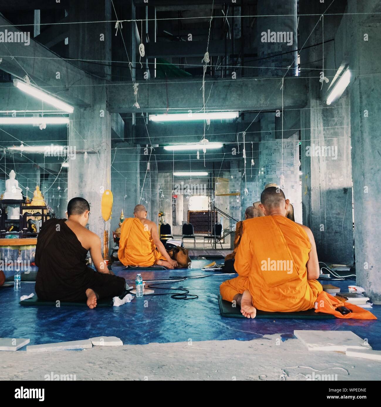 Sitting in temple hi-res stock photography and images - Alamy