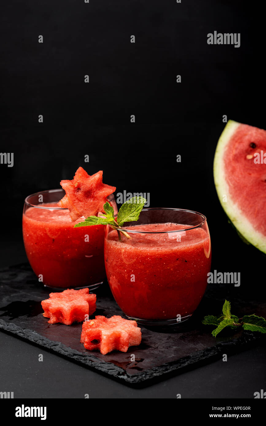 Watermelon smoothie fresh juice with mint and pieces in the shape of ...