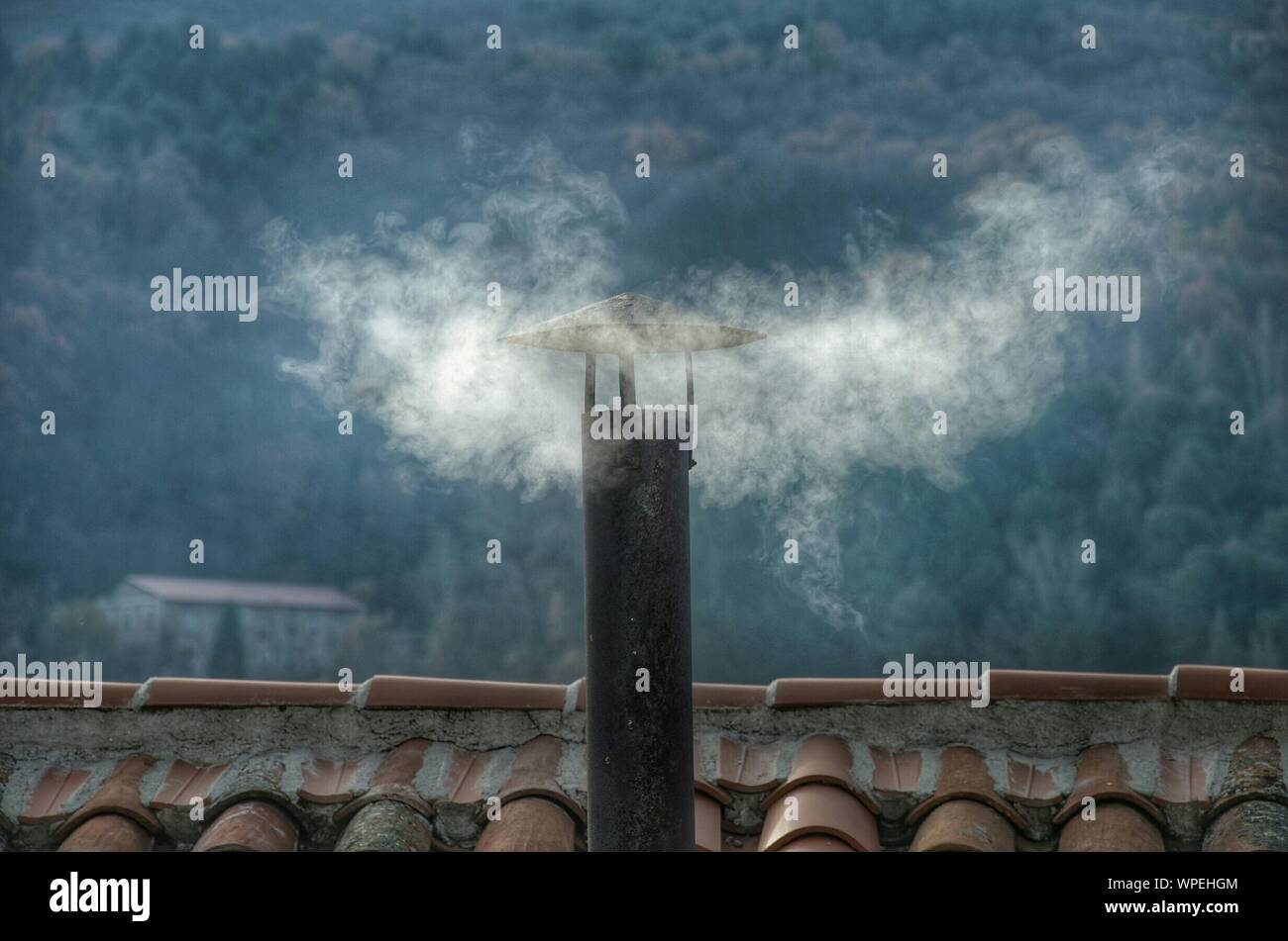 Smoke coming from chimney hi-res stock photography and images - Alamy