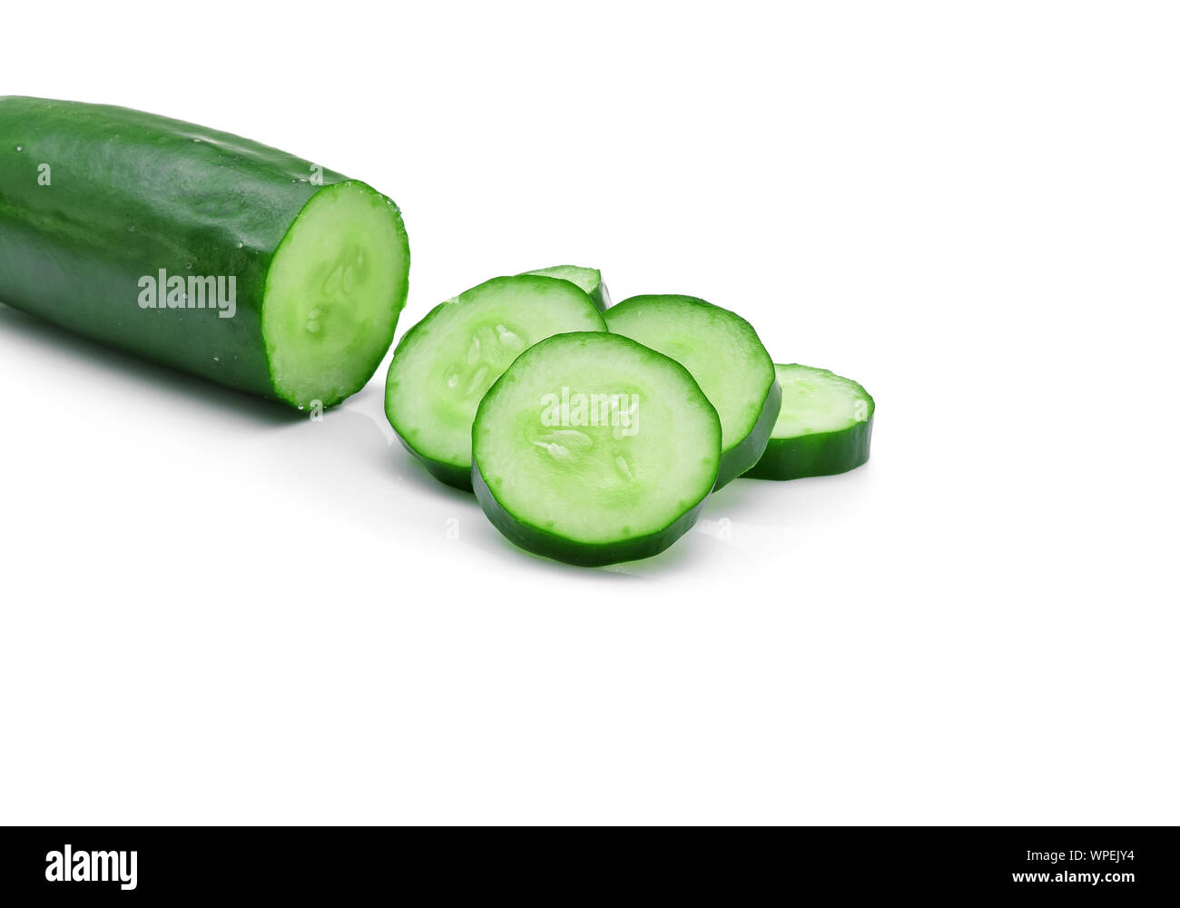 chopped cucumber isolated on white Stock Photo - Alamy