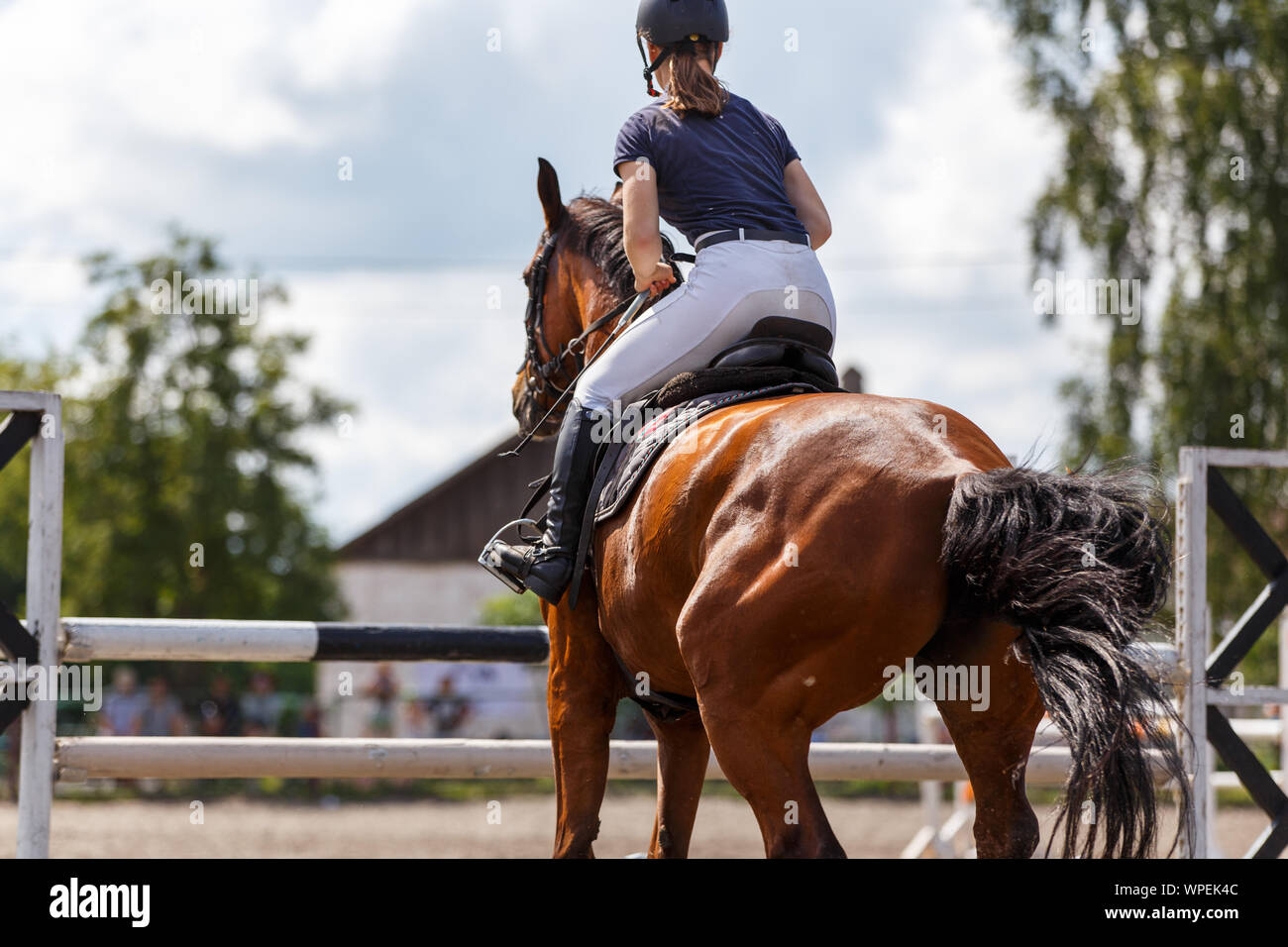Young girl riding horse on equestrian sport contest. Show jumping image ...
