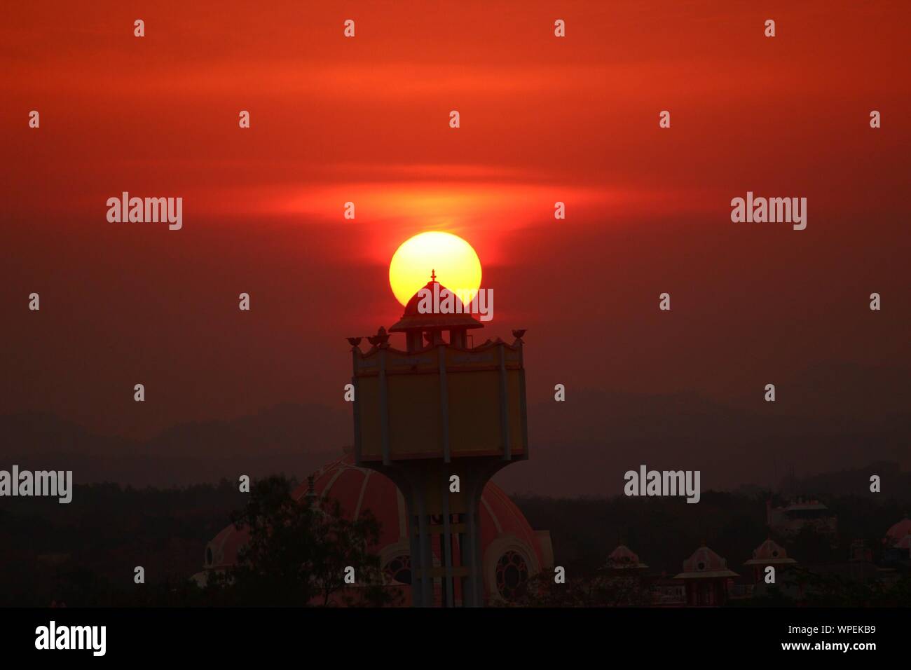 Sun behind tower hi-res stock photography and images - Alamy