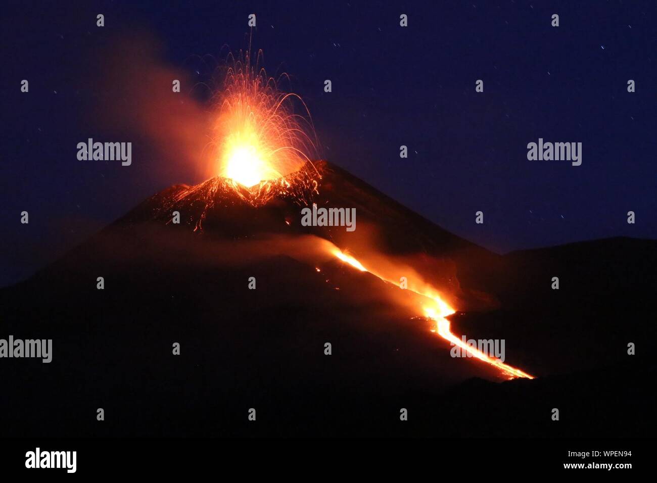 Volcano Erupting At Night Stock Photo - Alamy