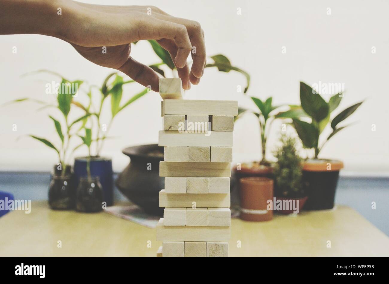 Jenga blocks hand hi-res stock photography and images - Alamy