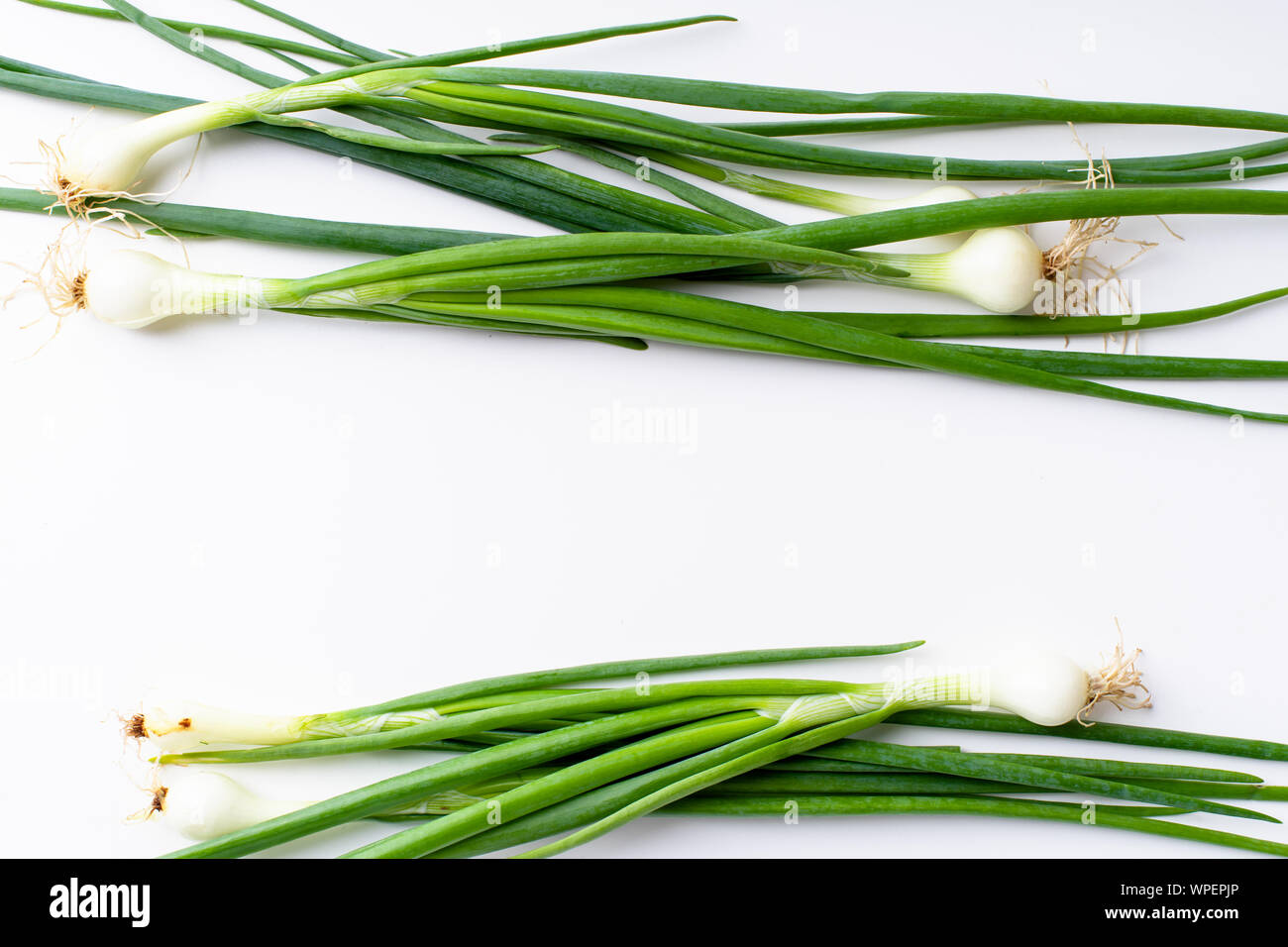 Creative layout with fresh green chives isolated on white background ...