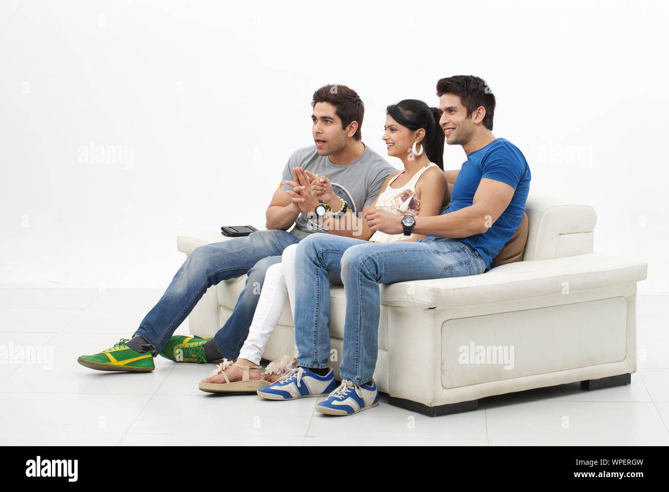 Group of friend watching TV Stock Photo - Alamy