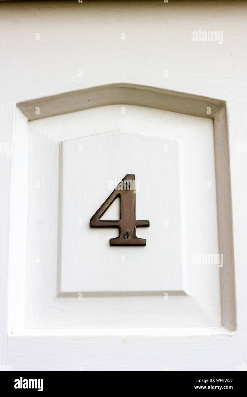 House number 4 on a white wooden front door Stock Photo - Alamy