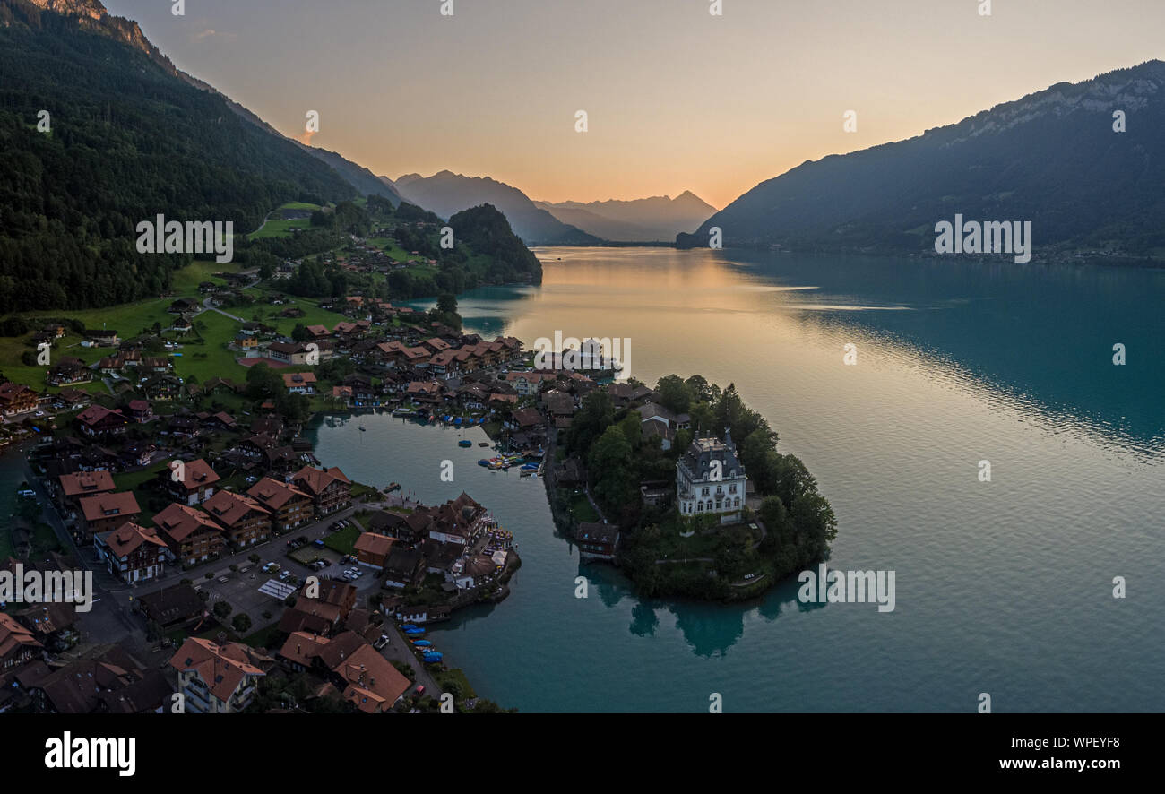 Overhead drone aerial view of The beautiful lake Brienz and village of ...