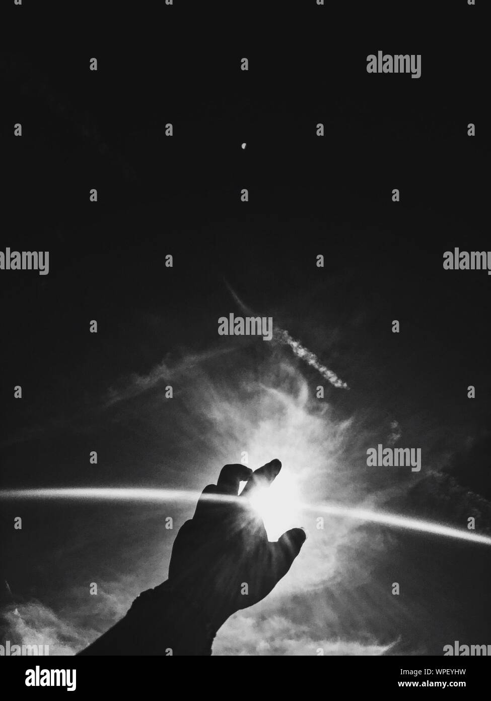 Optical illusion hand holding sun hi-res stock photography and images ...